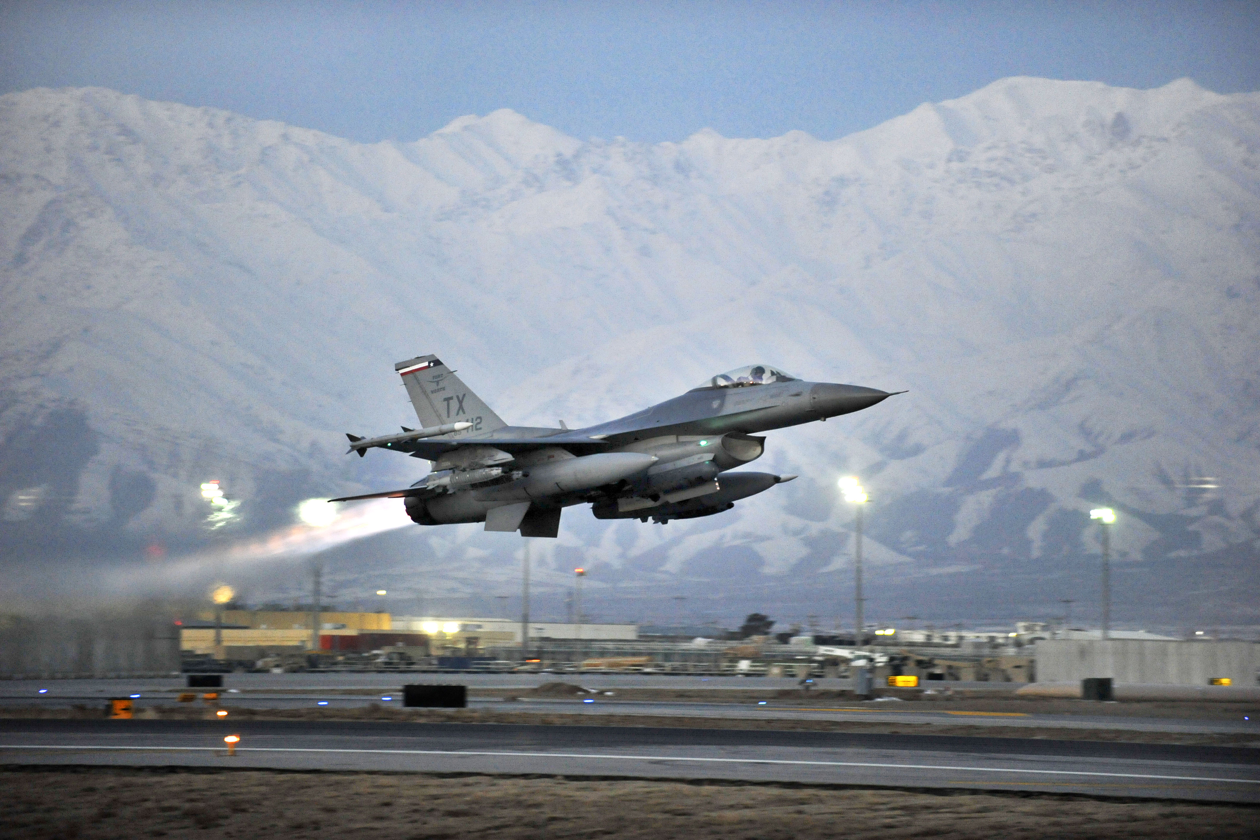 A U.S. Air Force F-16 Fighting Falcon aircraft takes off on a mission ...