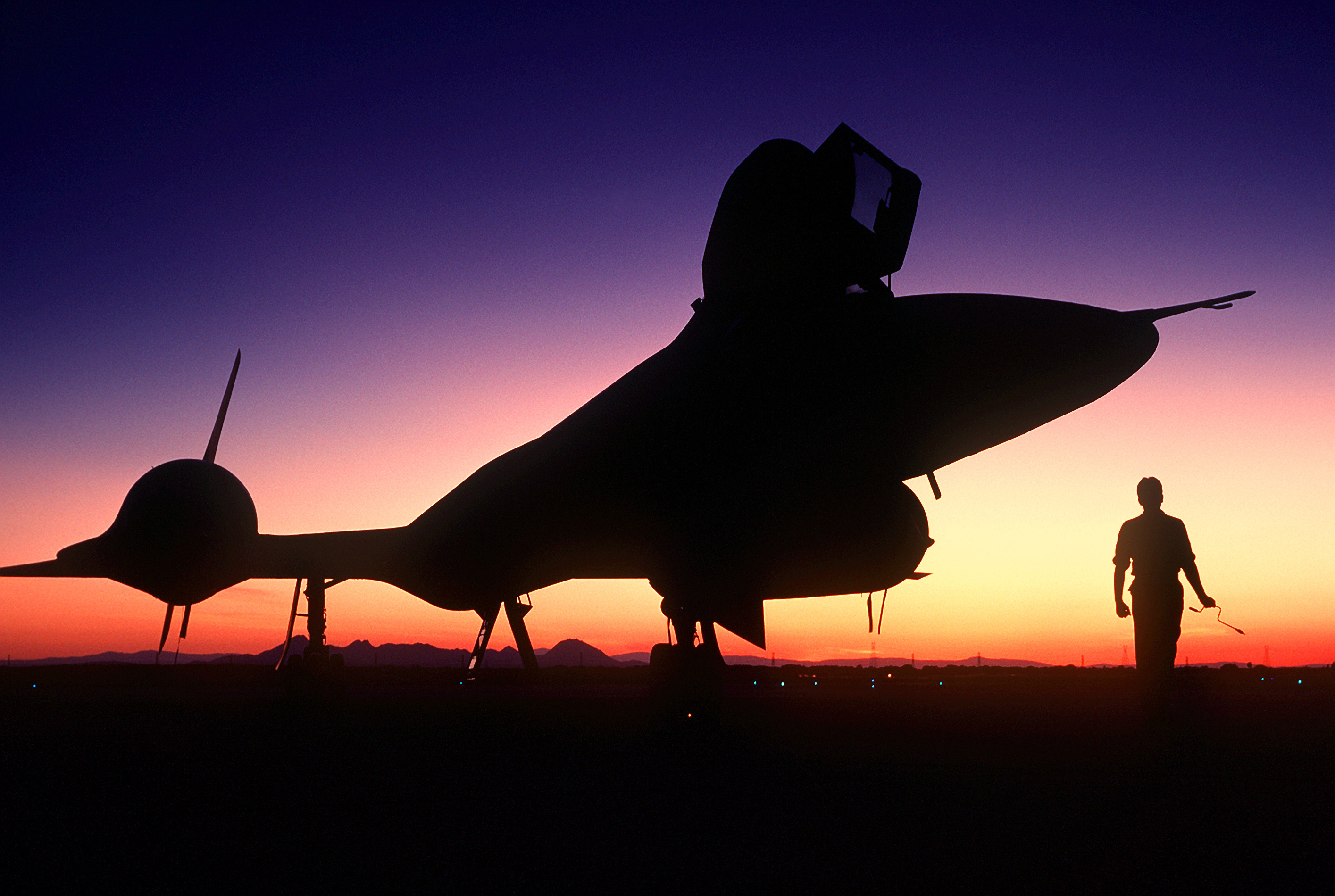 Airmen prepare a SR-71 Blackbird for flight at Beale Air Force Base ...