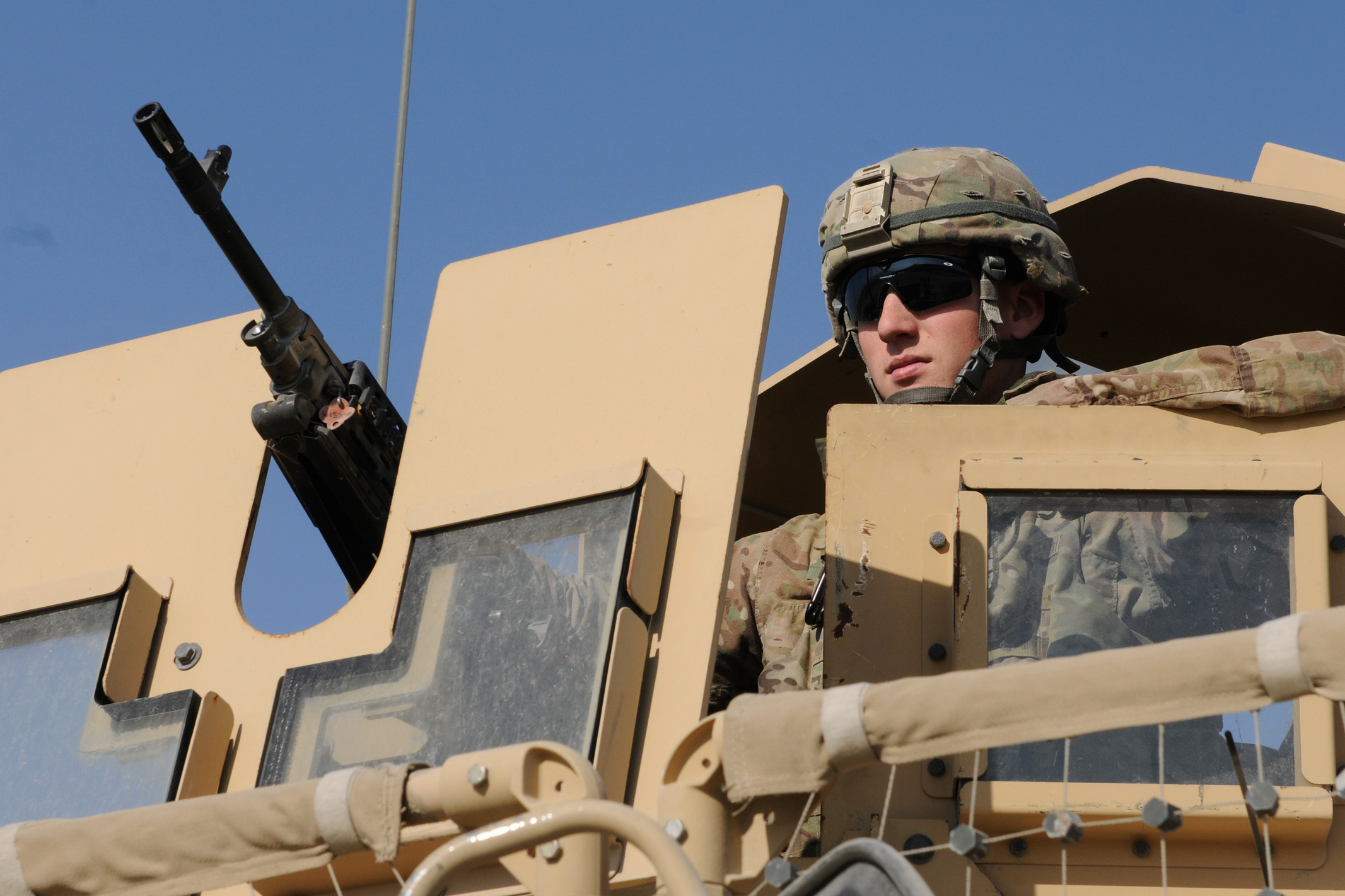 U.S. Army Spc. Kory Klinger provides security around the site where ...