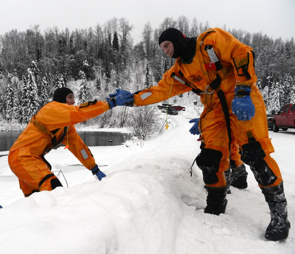 JBER 673d CES firefighters conduct annual ice water rescue training