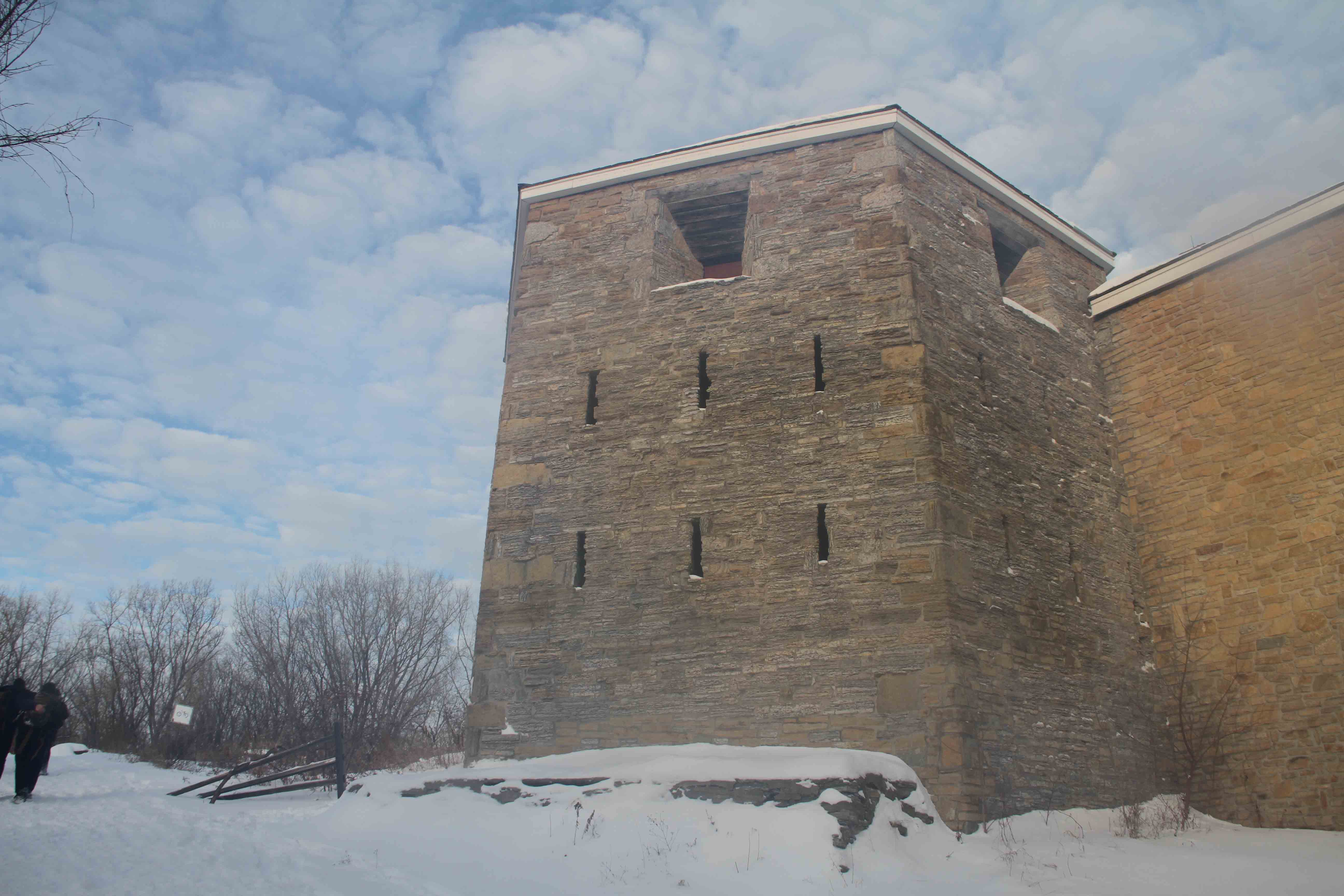 Marines take pooees on a hike at historic Fort Snelling