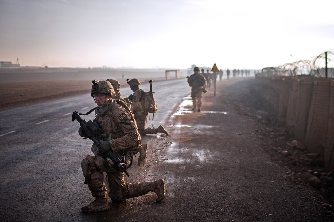 U.S. soldiers patrol around Tarin Kowt, Afghanistan, Jan. 11, 2014.