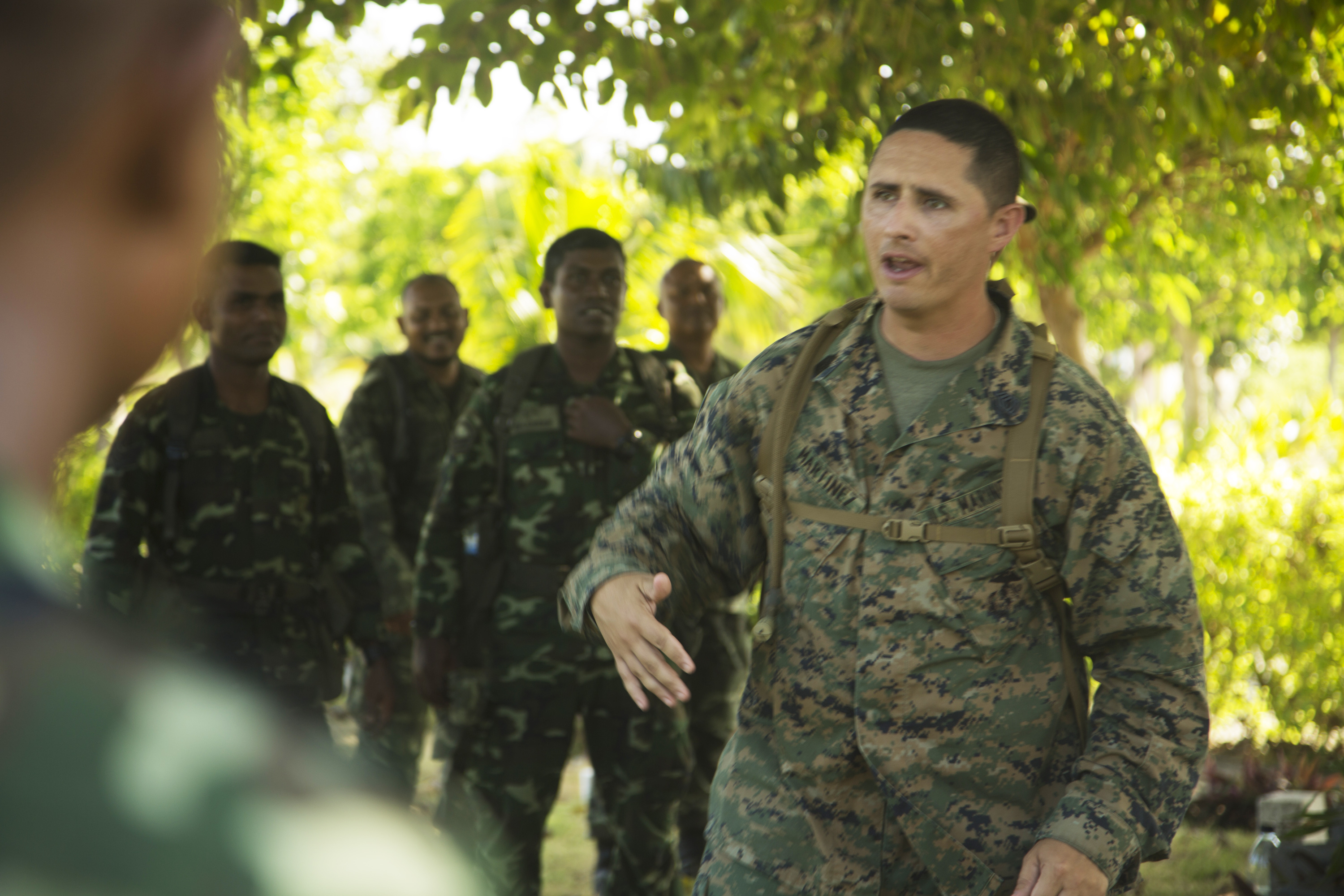 U.S. Marine Corps Master Sgt. John Martinez speaks with Maldivian ...