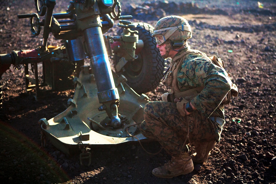 U.S. Marine Corps Sgt. Tony I. Kantor prepares to fire an M327 120mm ...