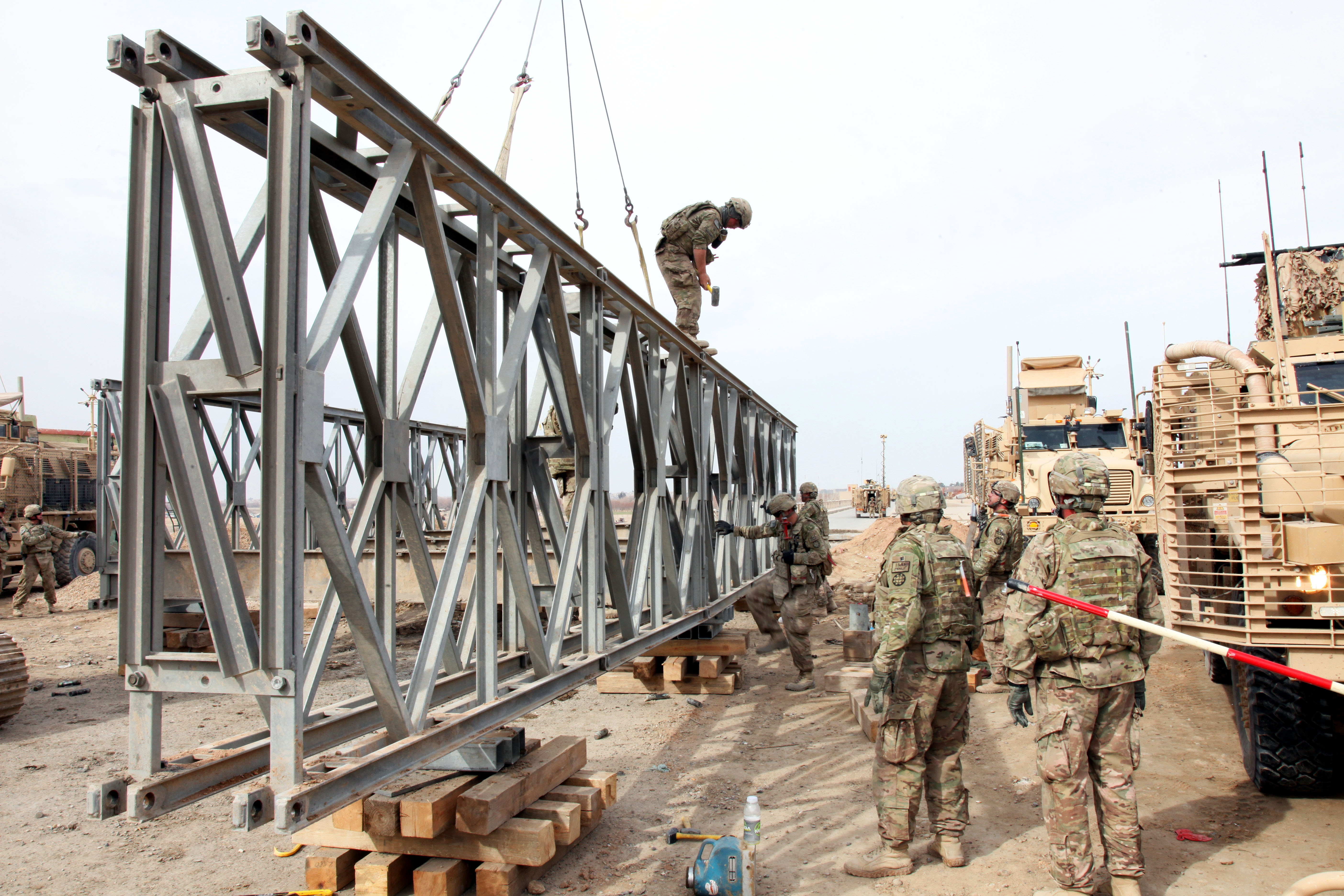 U.S. soldiers disassemble an over bridge in the Gereshk district of ...