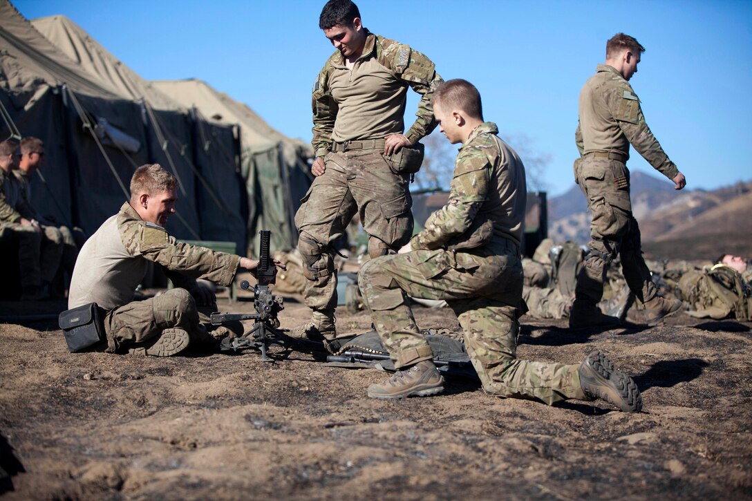 Army Rangers clean weapons after conducting training on Fort Hunter ...