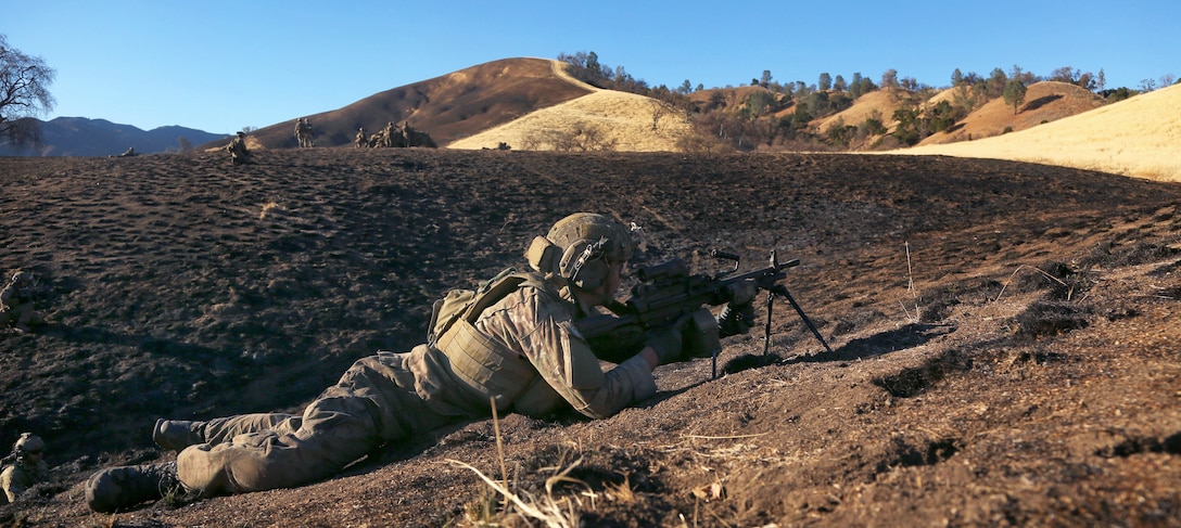 An Army Ranger provides security with an MK46 machine gun during Task ...