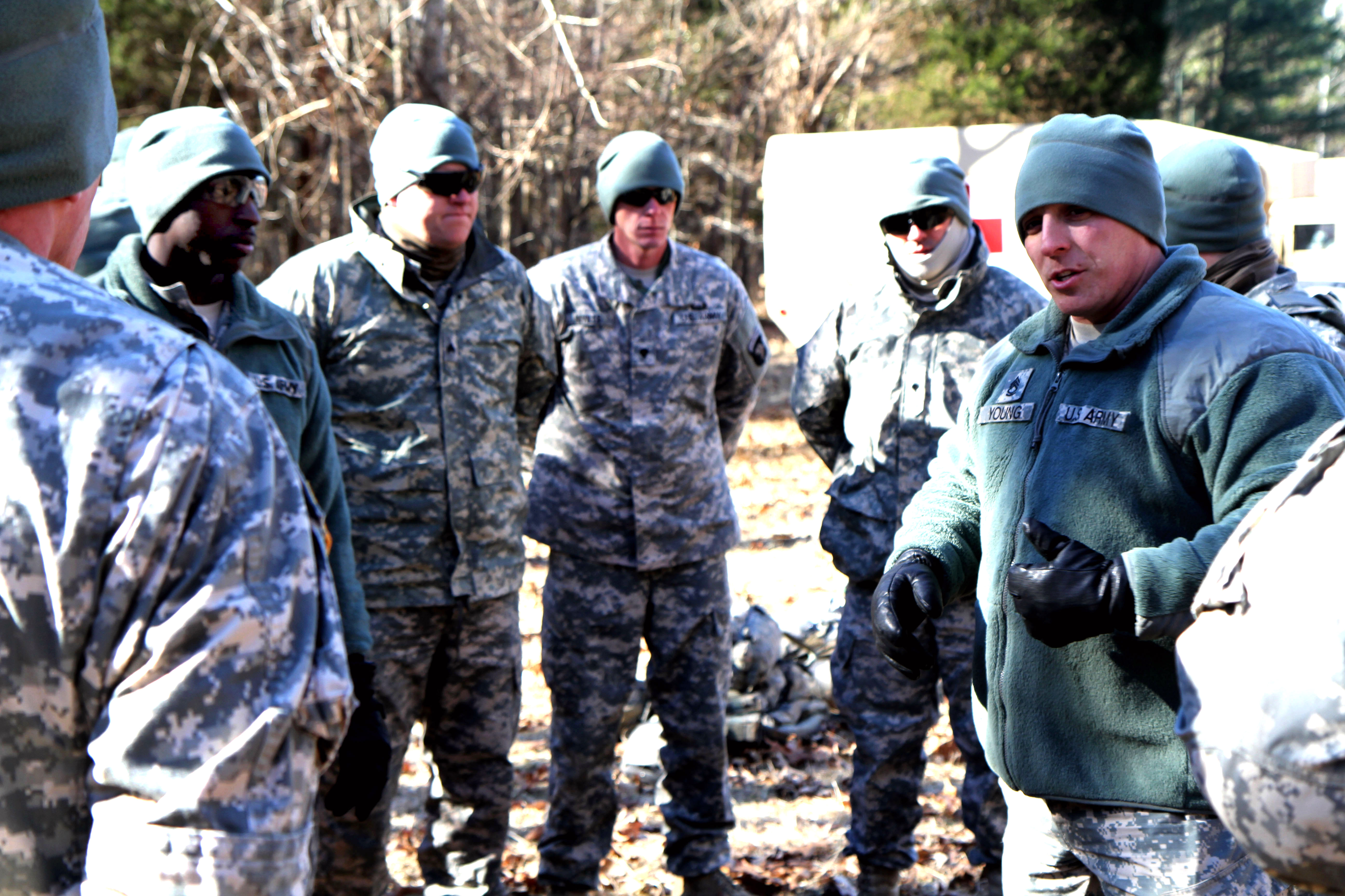 Army Sgt. 1st Class Ronald Young, right, gives a safety briefing to ...