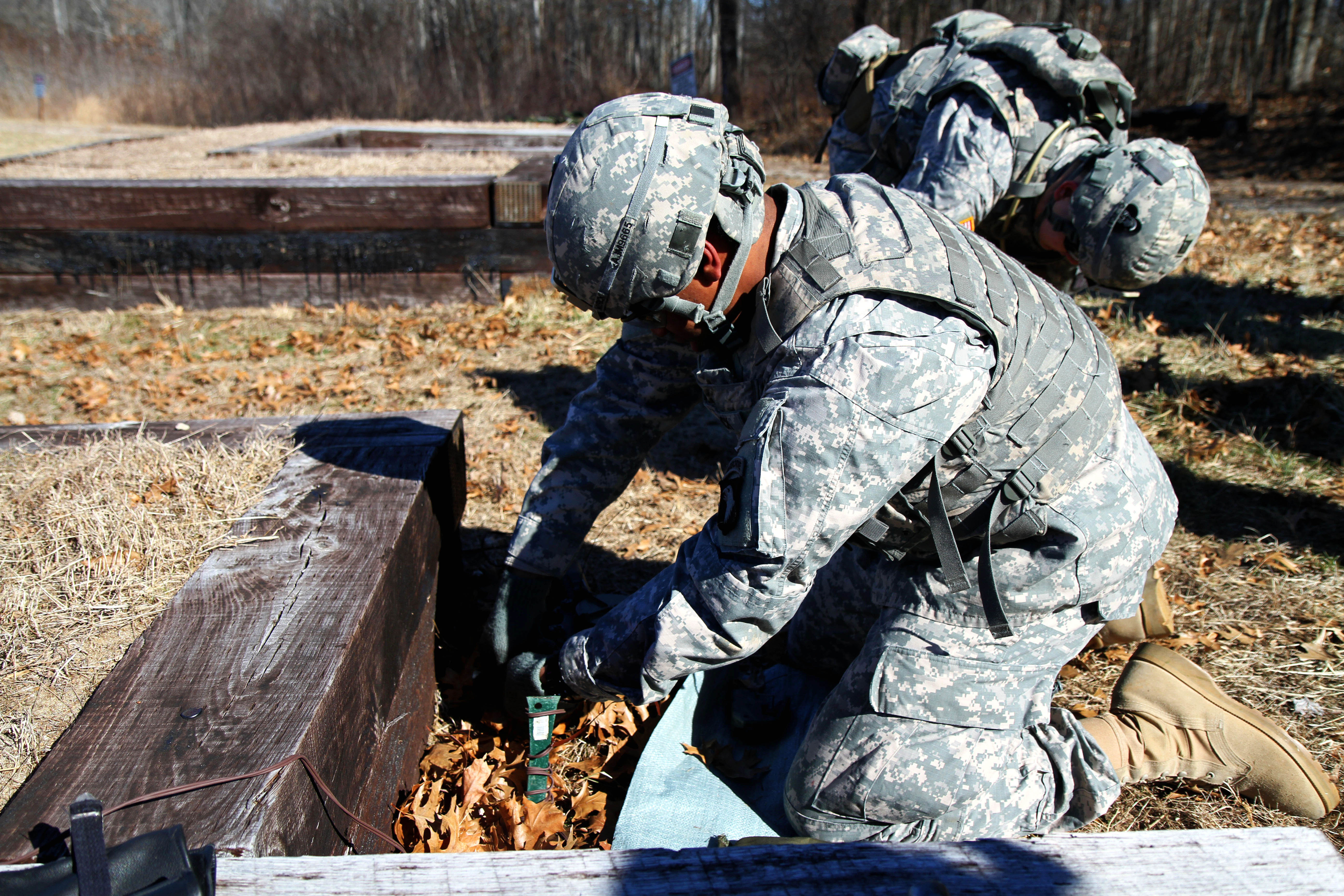Army Pvt. James Myrick connects an M18A1 Claymore mine to a Spider ...