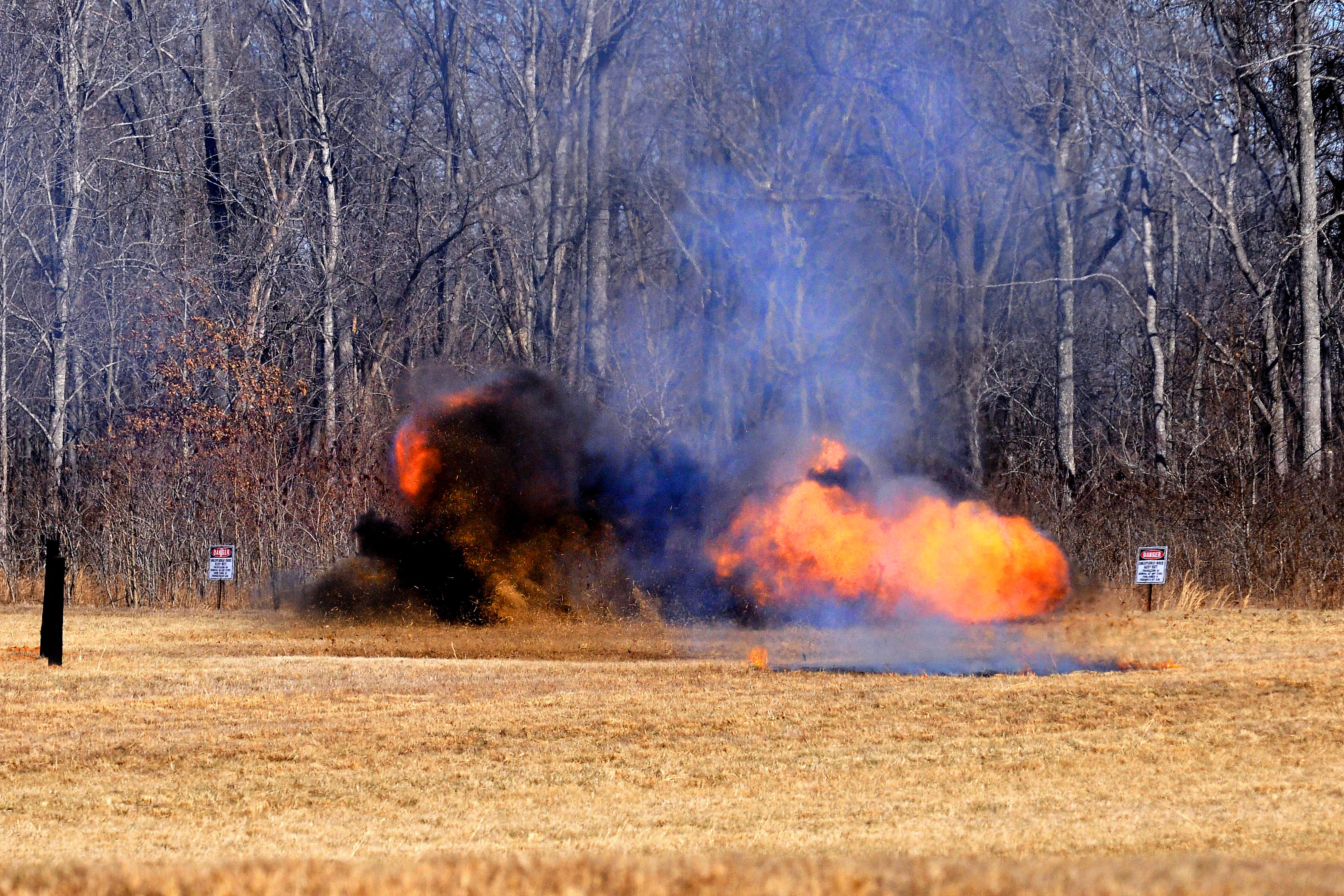 Soldiers observe a series of detonations of M18A1 Claymore Mines at a ...