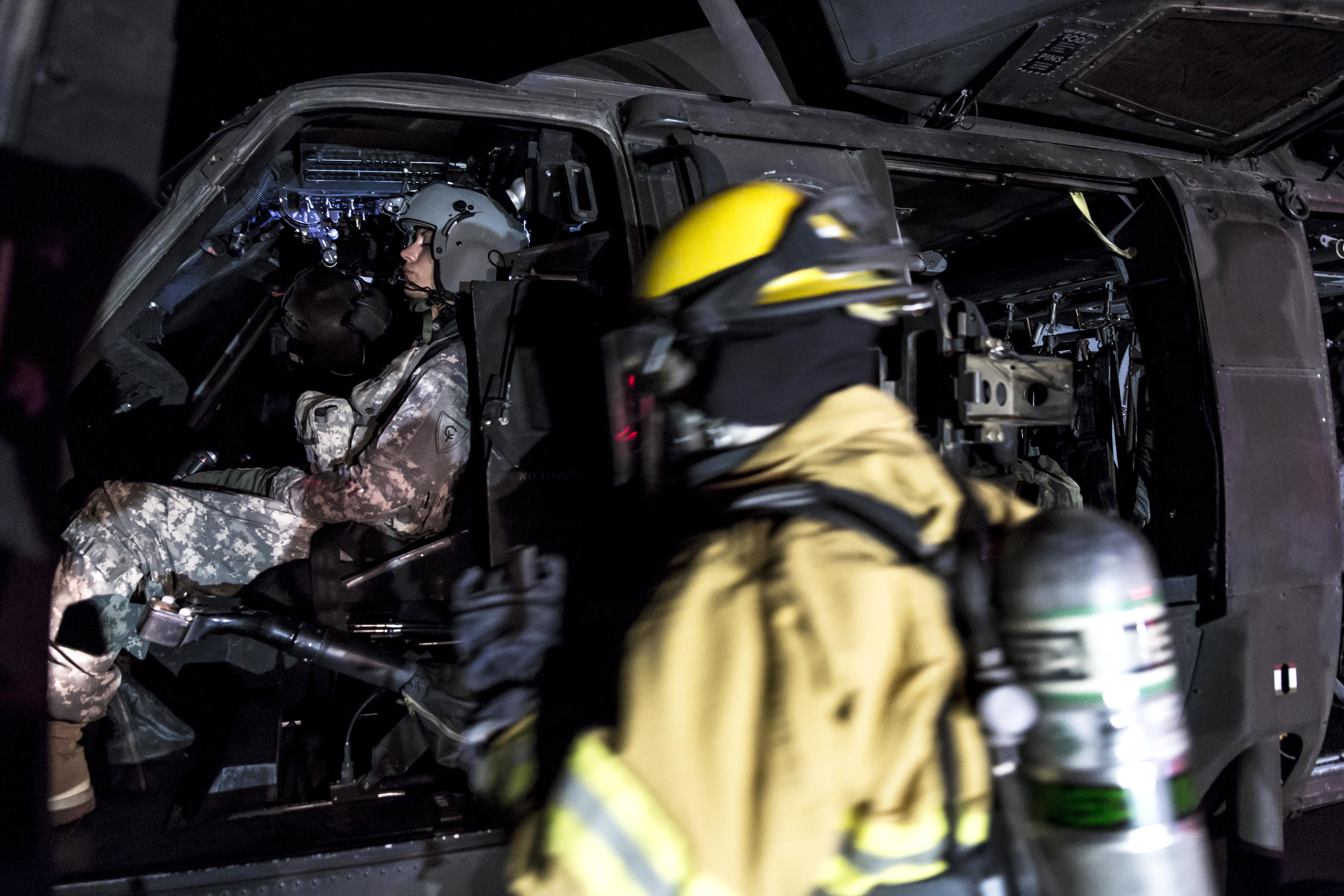 U.S. Army Capt. Mindy Wallace, left, plays a mock casualty during a UH ...