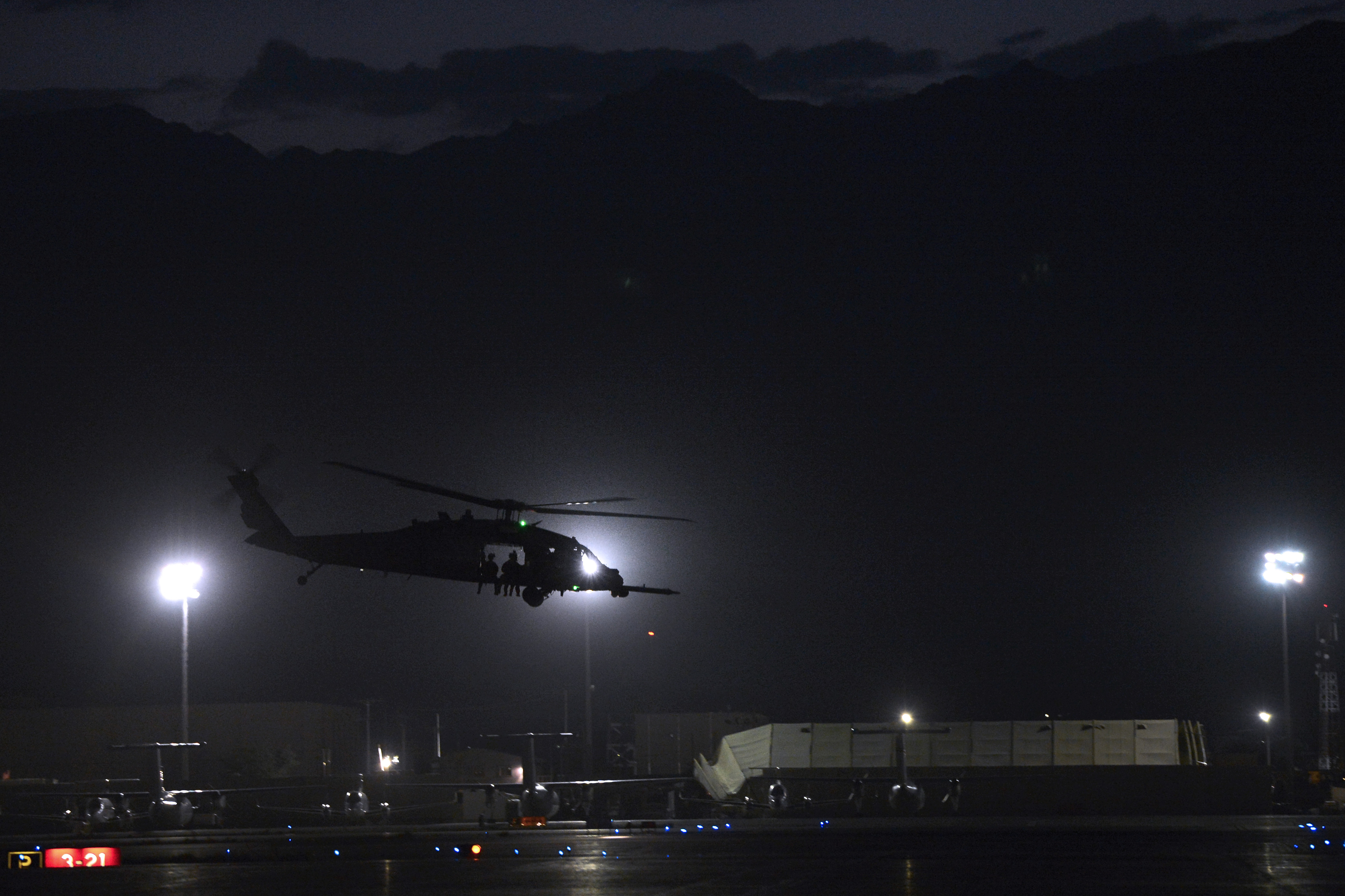 A U.S. Air Force pararescue team takes off in an HH-60G Pave Hawk ...
