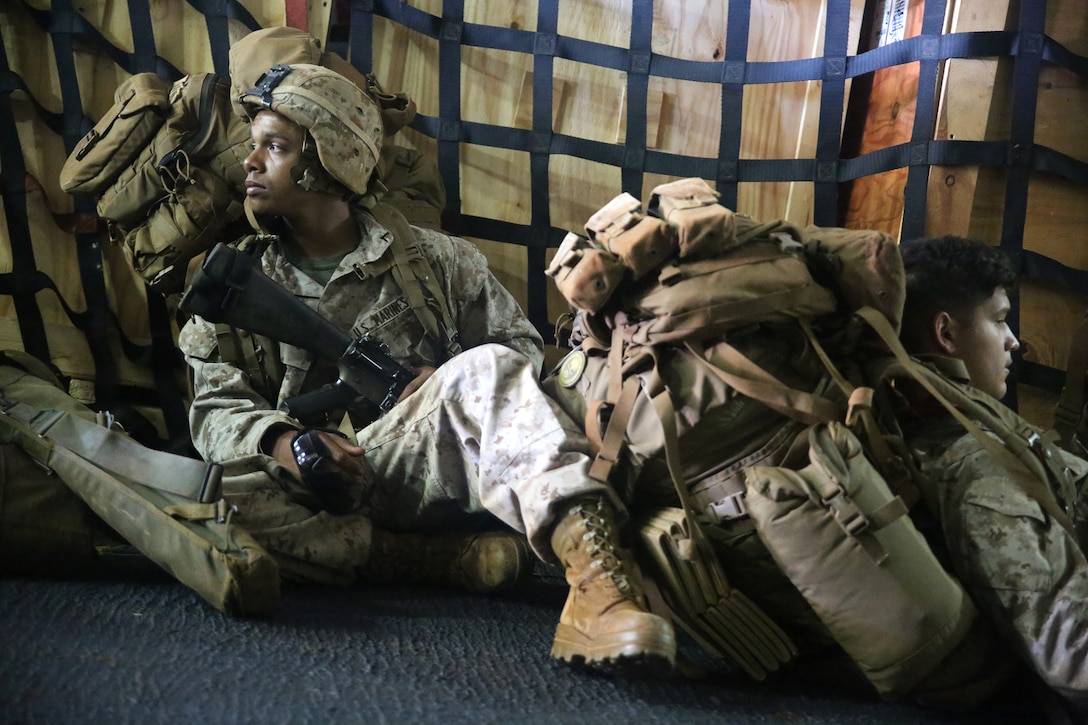 U.S. Marines unload gear at PTA