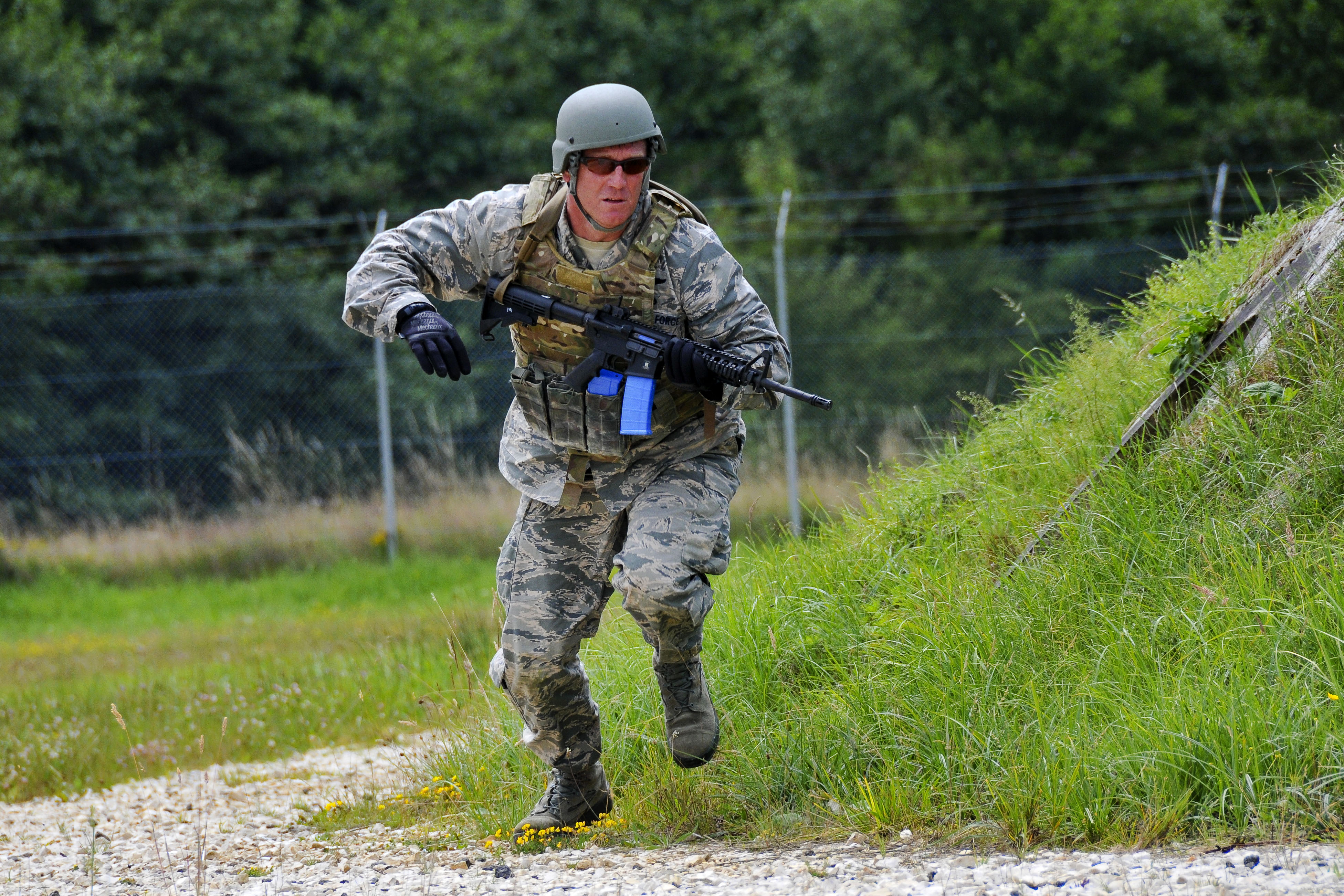 U.S. Air Force Col. Bradford Everman races to a simulated fallen airman ...