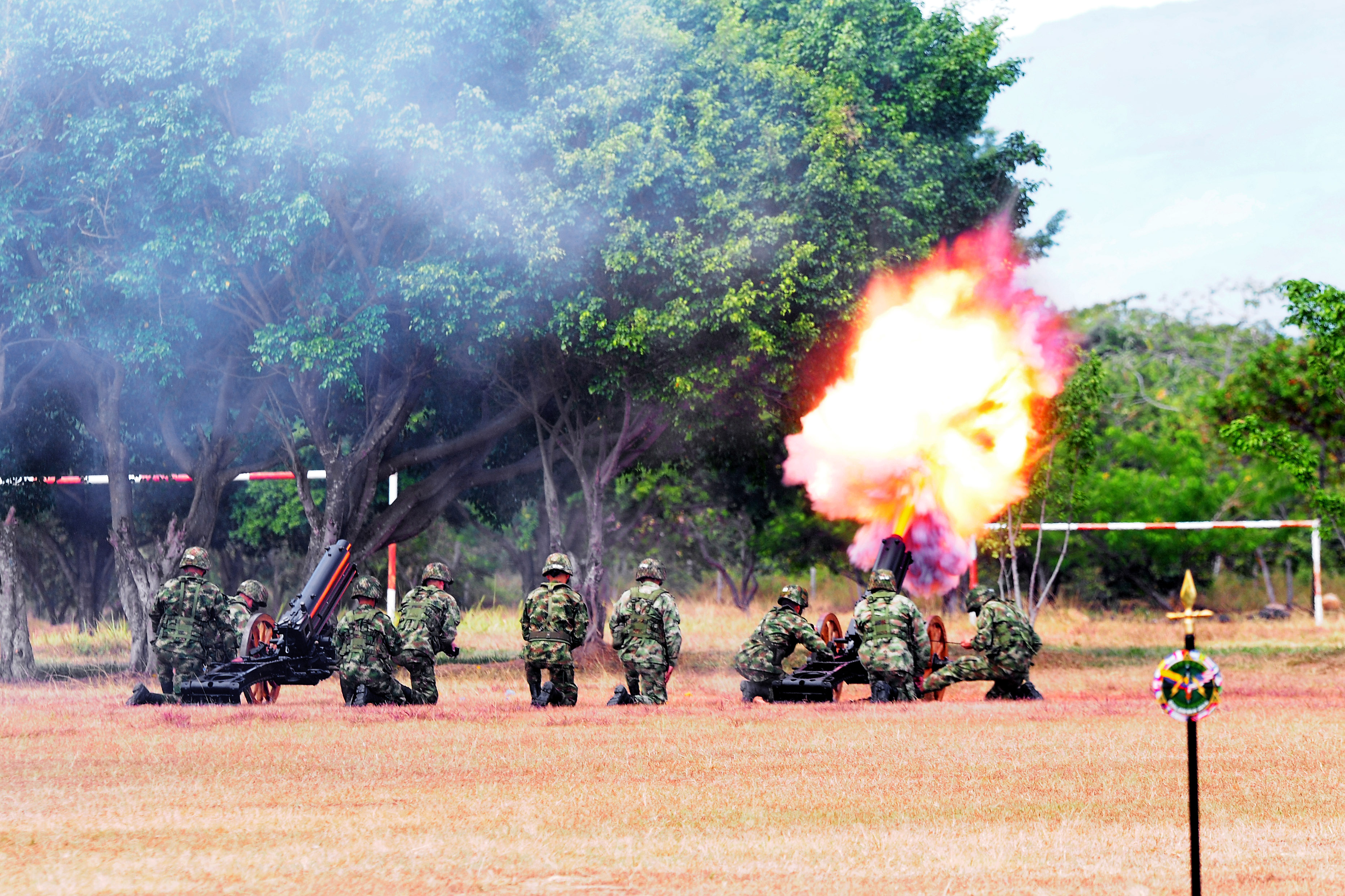 Colombian army artillery members fire a cannon to officially start the ...