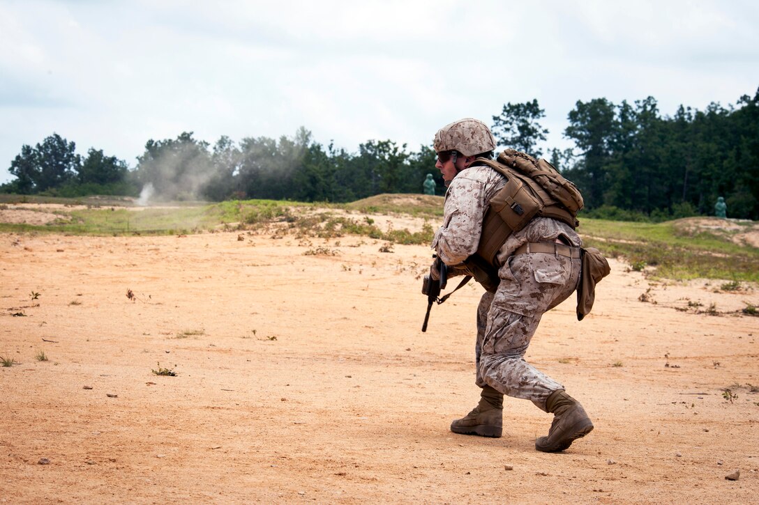 A Marine conducts immediate action drills during a live-fire exercise ...