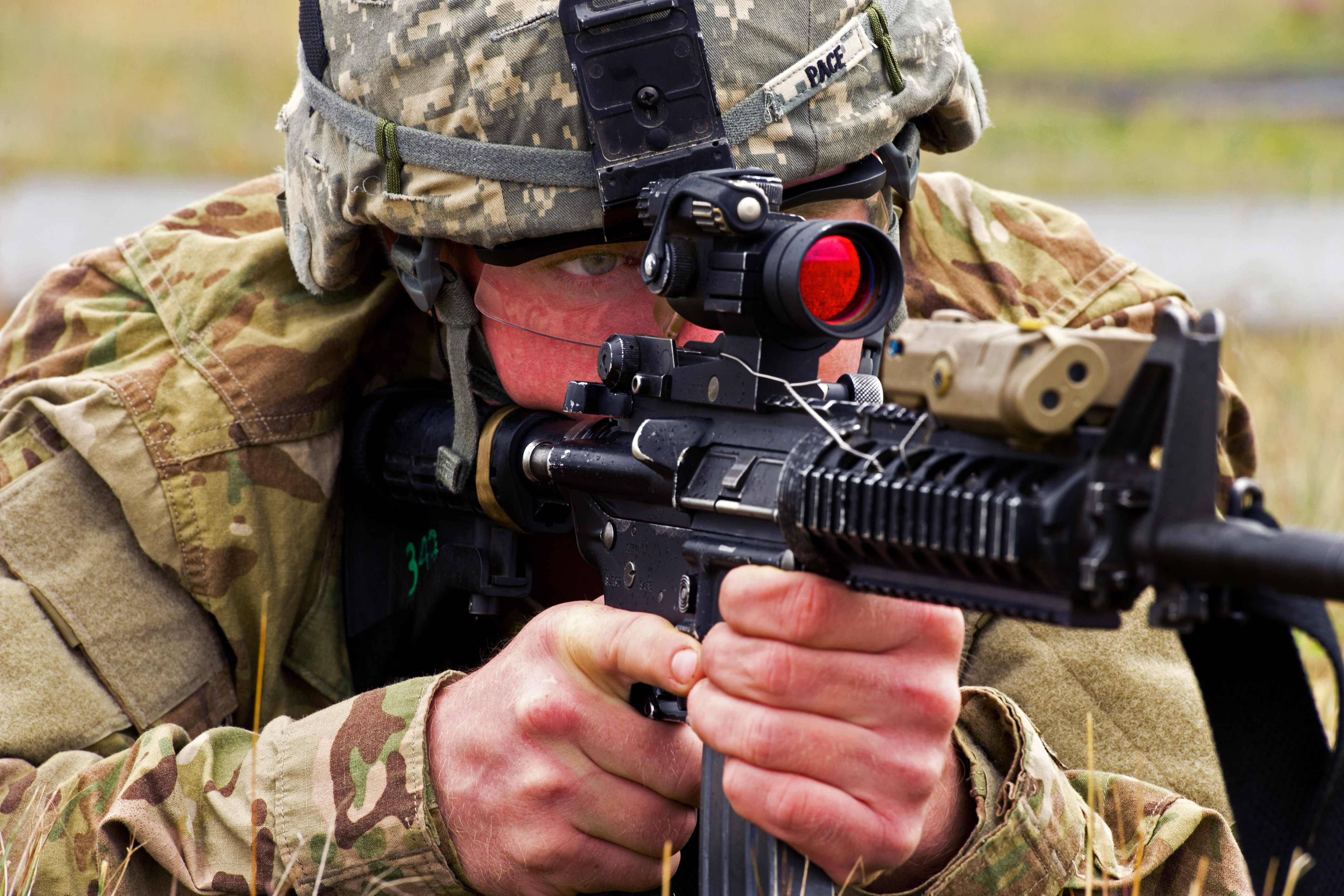 Army Pvt. Steven Pace simulates enemy forces during a demonstration as ...