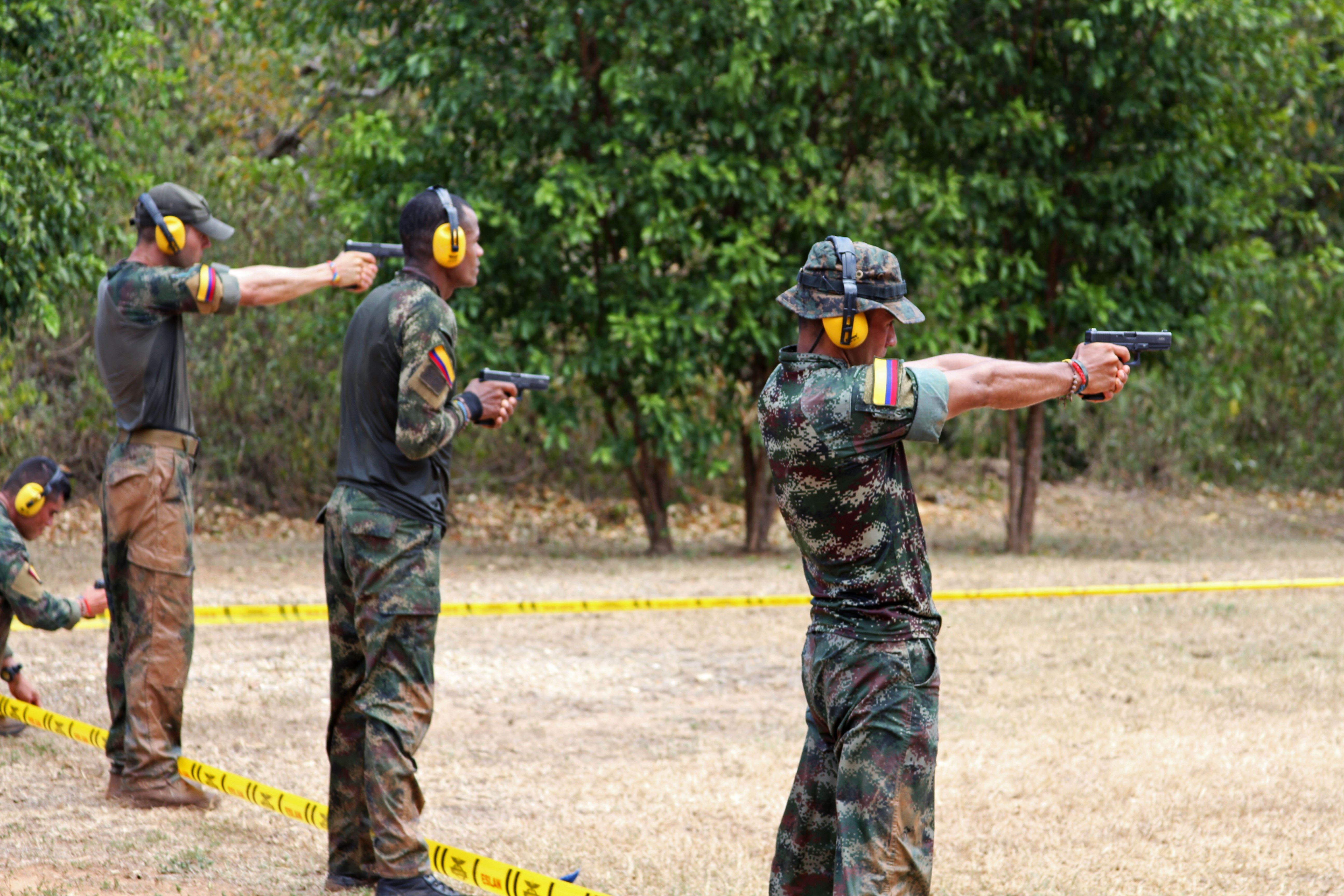 Colombian special operations team members compete in the pistol shoot ...