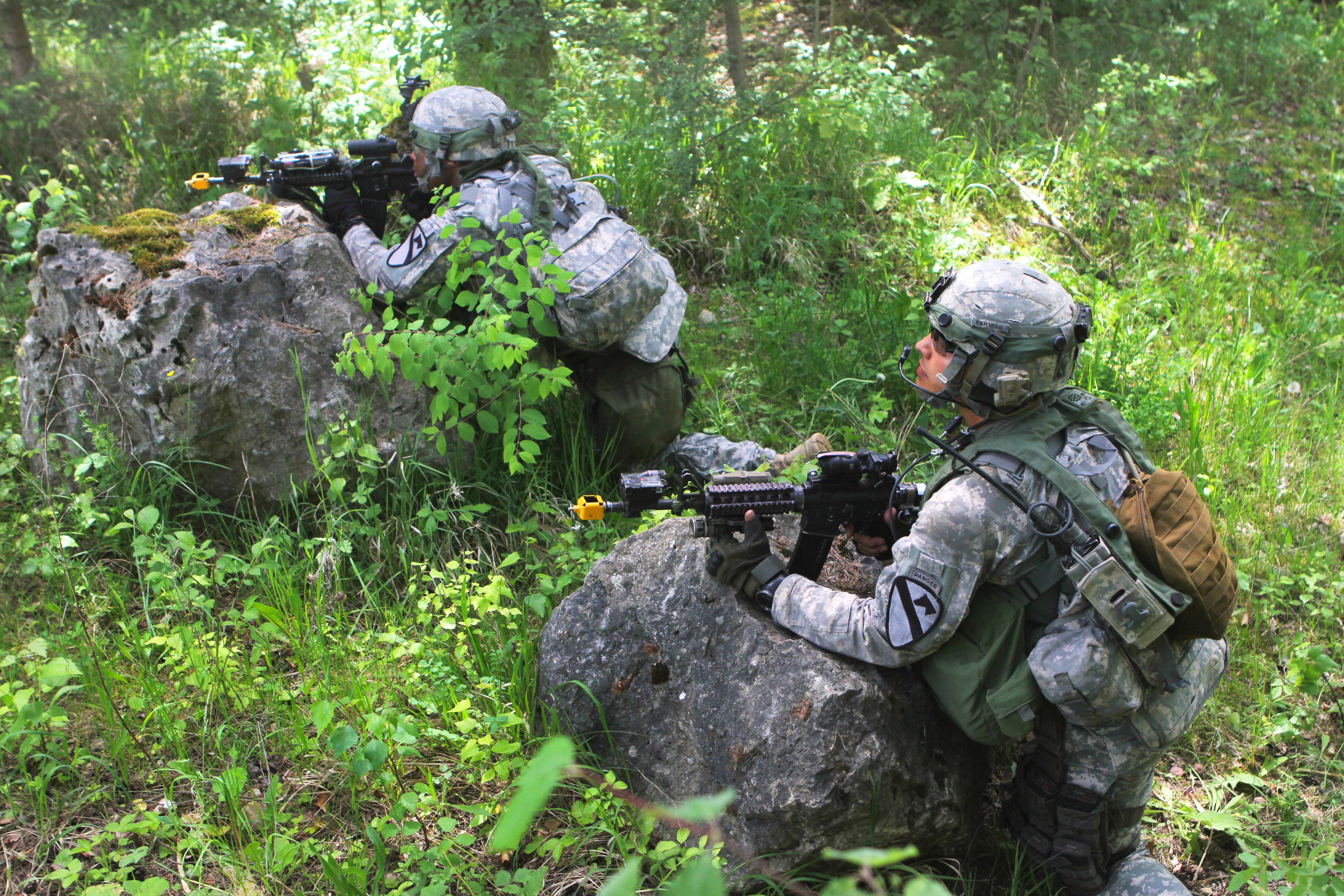 U.S. soldiers provide security while clearing a town during a partnered ...