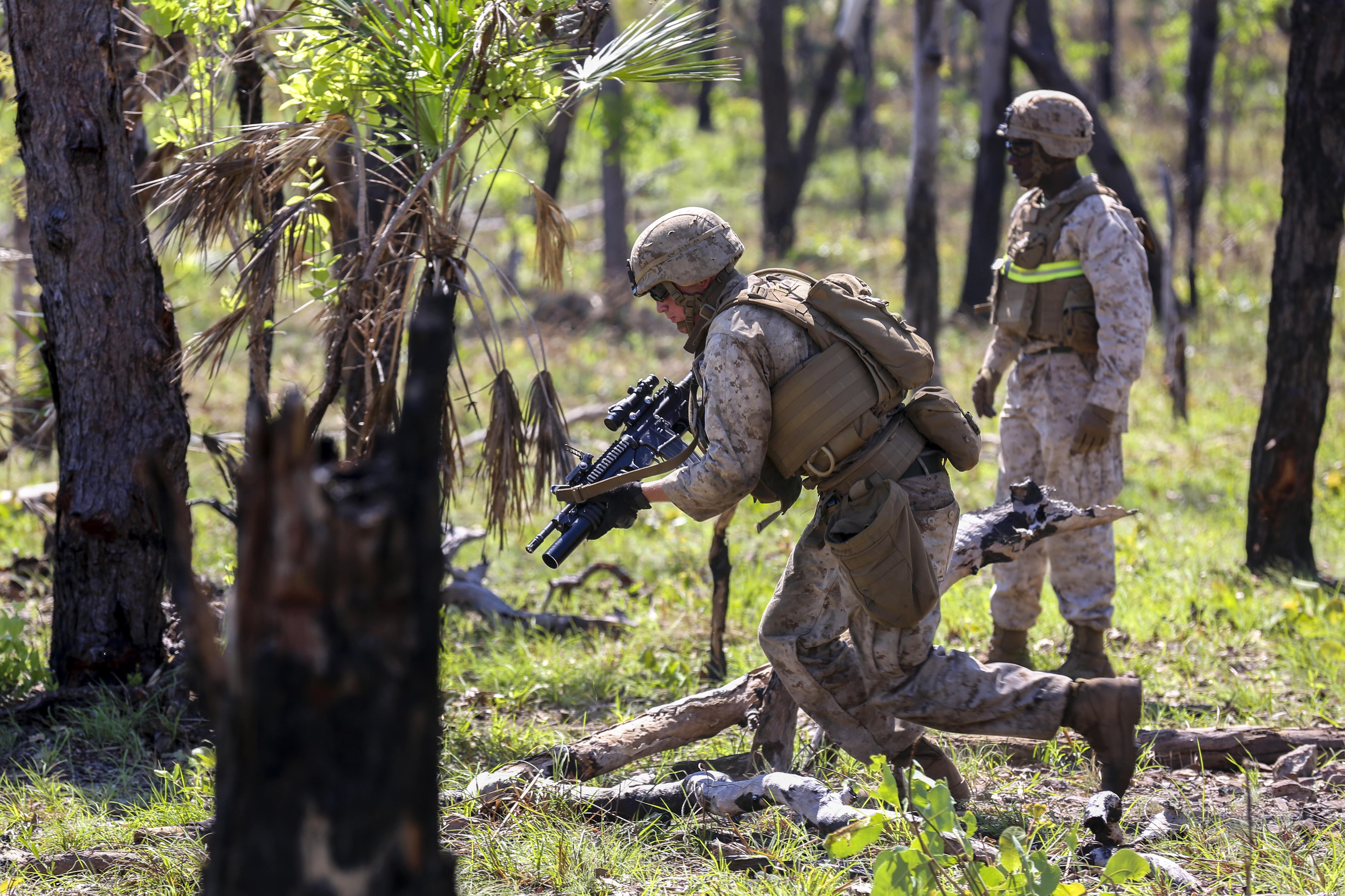 U.S. Marine Corps Lance Cpl. Joshua Williams advances forward while ...