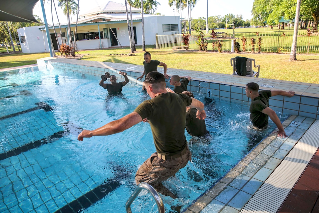U.S. Marines participate in a swimming event during a weeklong squad ...