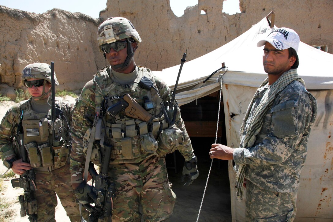 U.S. Army Capt. Rodney Freeman, foreground, and U.S. Army 1st Lt ...