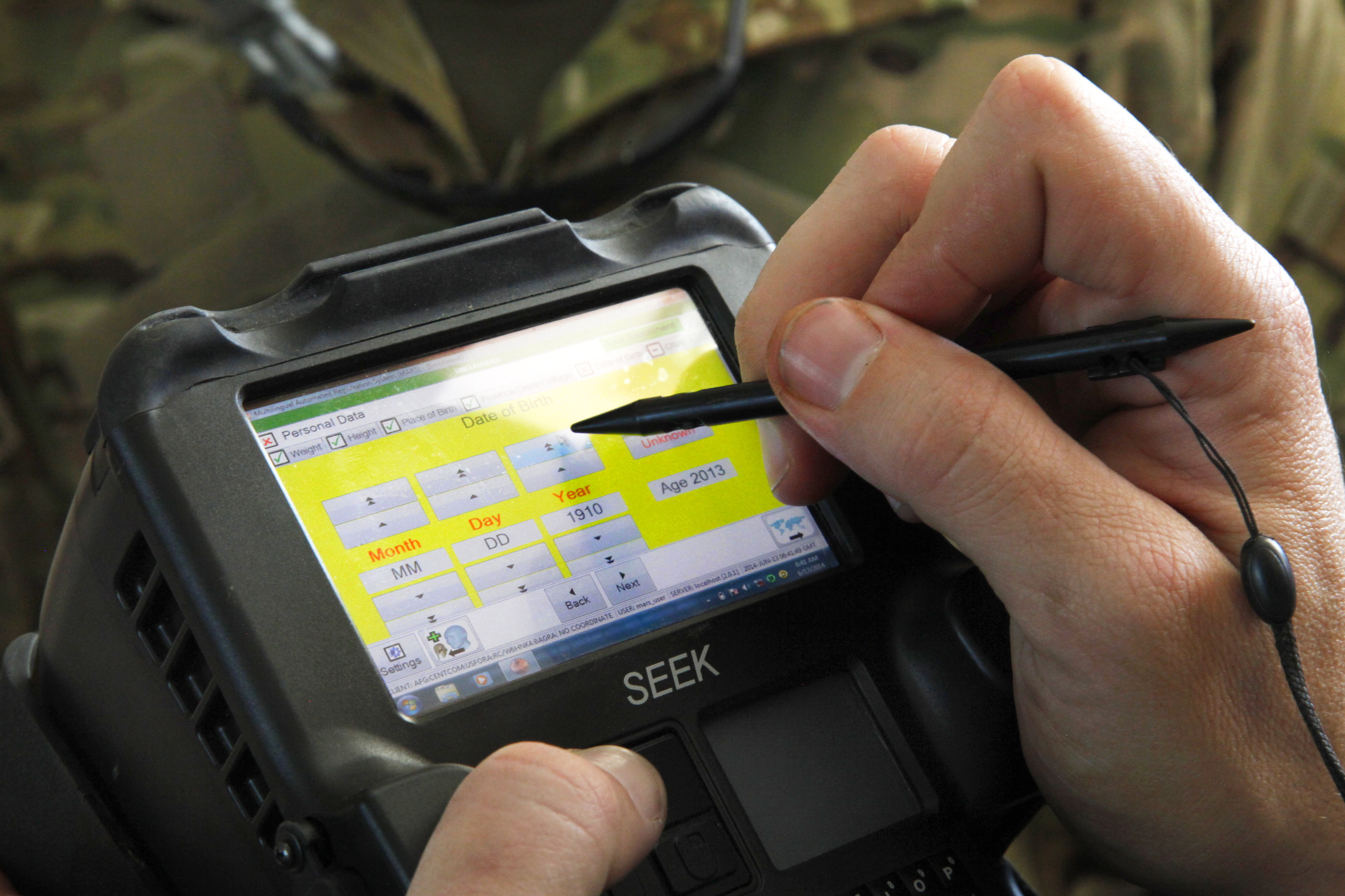 U.S. Army Staff Sgt. Justin Nelson collects the information of a ...