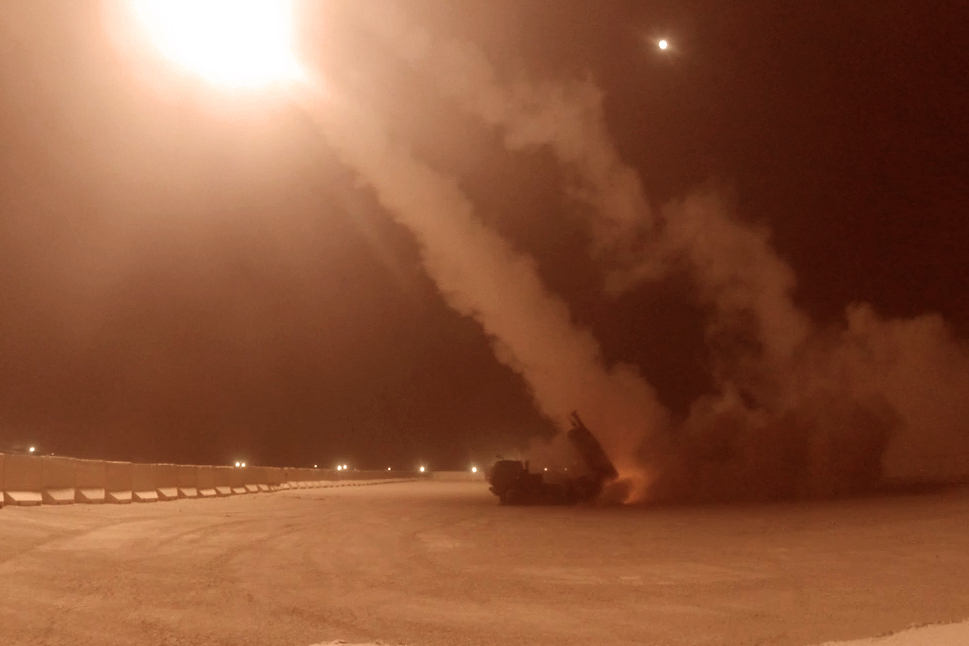 U.S. Marines fire a rocket from a High Mobility Artillery Rocket System ...