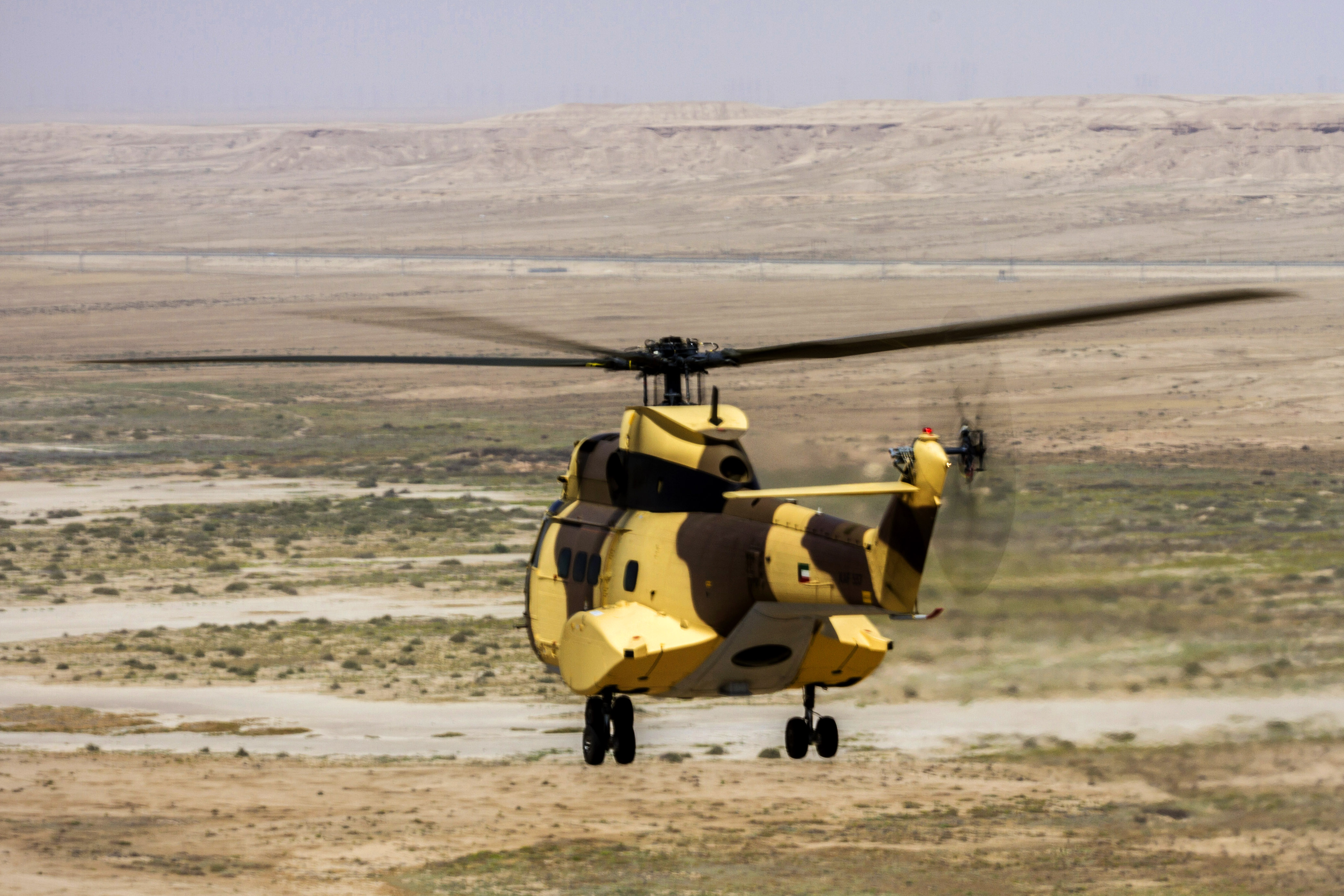 A Kuwaiti military SA 330 Puma helicopter flies toward a simulated ...