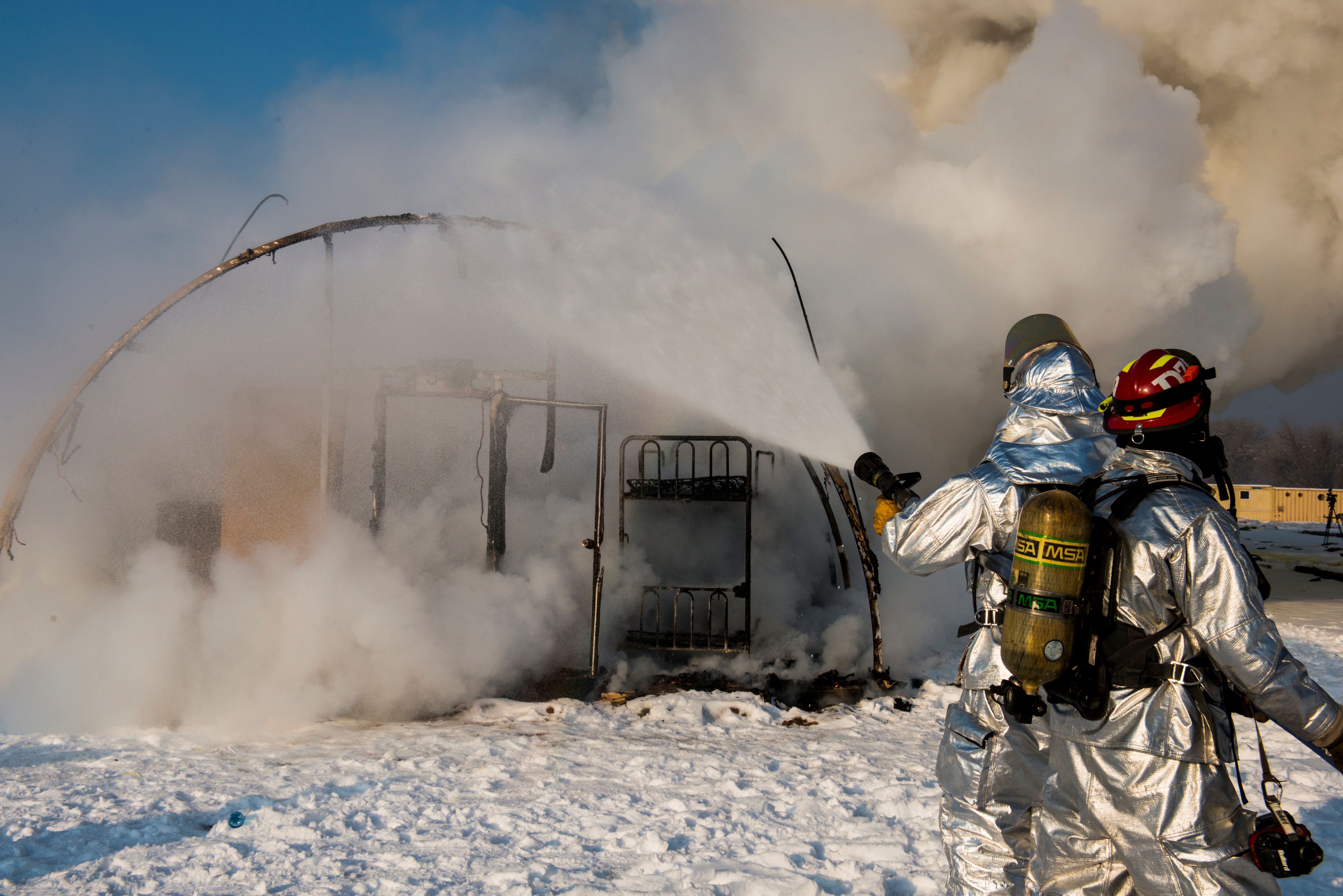 Deployed Firefighters battle inferno during training