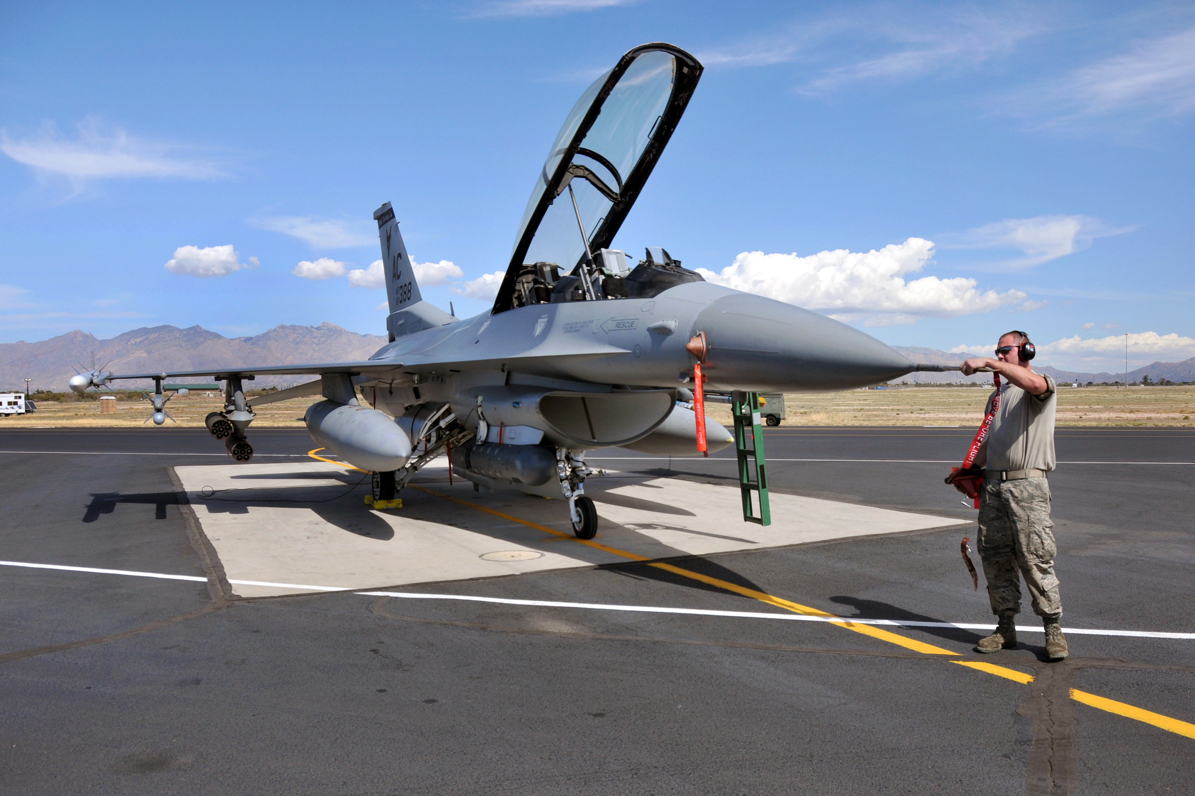 Air Force Senior Airman Tyler Spohn removes a pitot tube safety cover ...