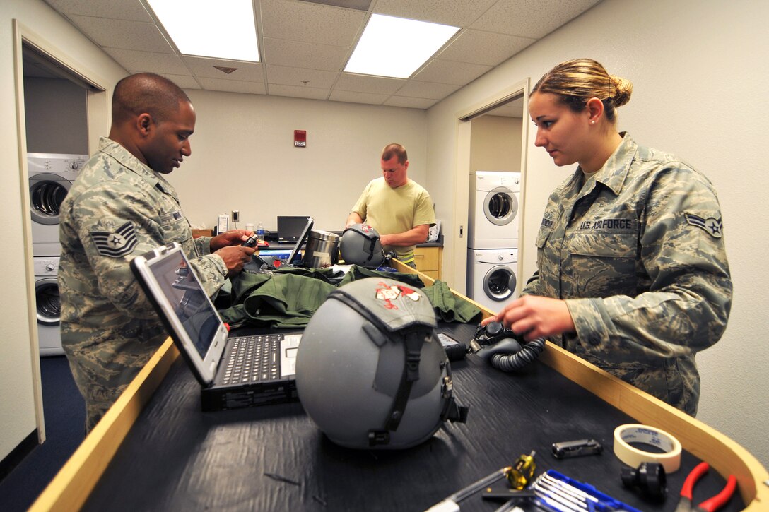 Air Force Airman 1st Class Shauna Hendrickson, right, Tech. Sgt. Jarod ...