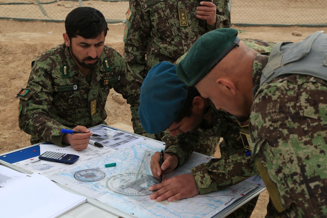 Afghan National Army soldiers fire a 122mm Howitzer 2A18 (D-30)