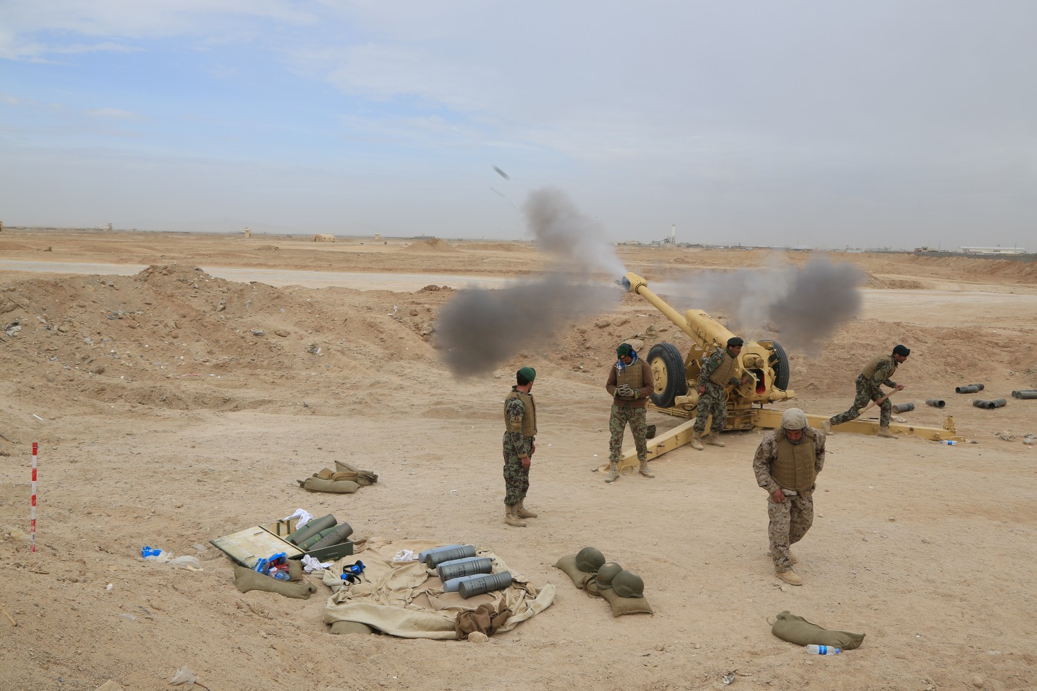 Afghan National Army soldiers fire a 122mm Howitzer 2A18 (D-30)