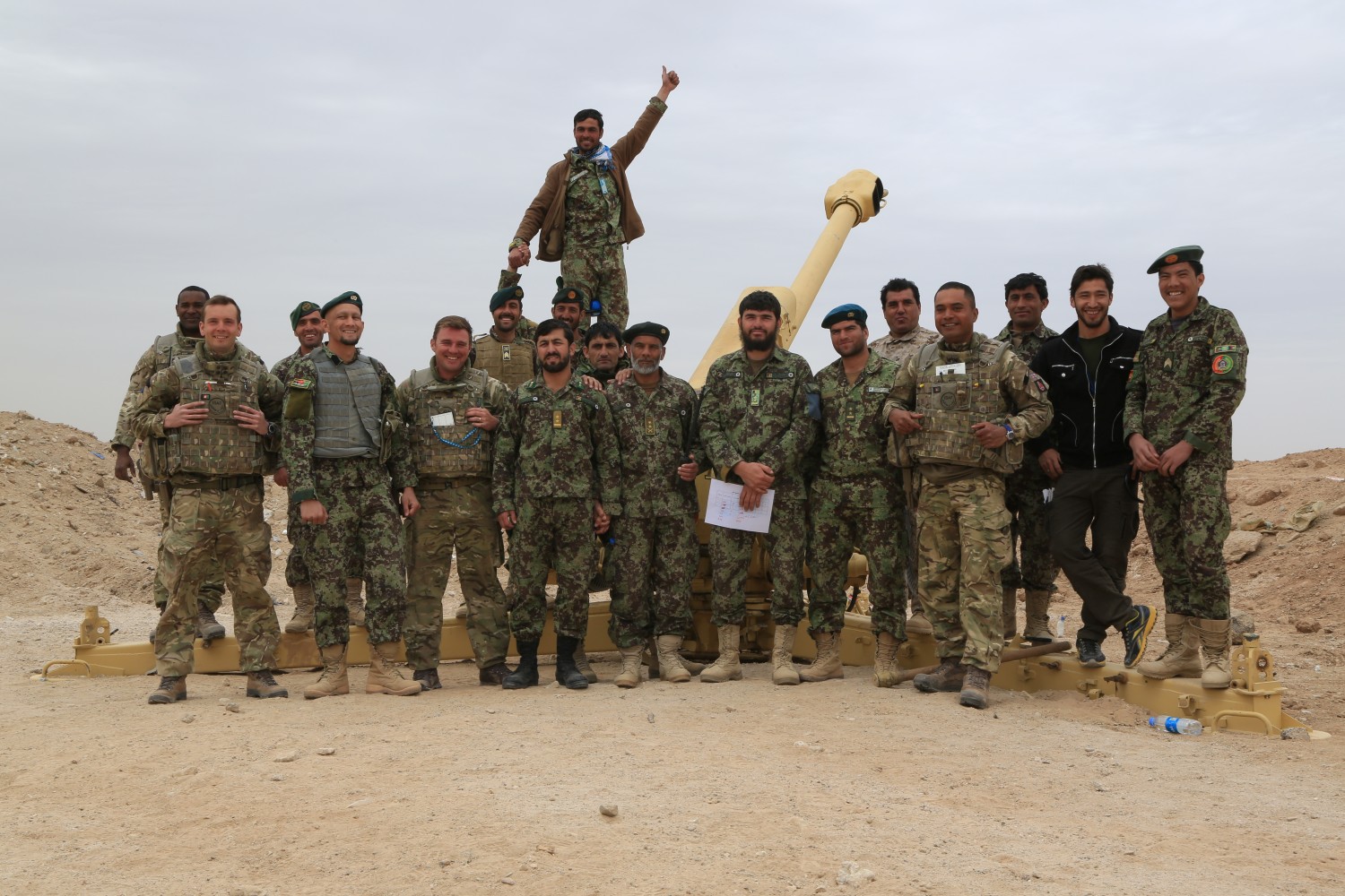 Afghan National Army soldiers fire a 122mm Howitzer 2A18 (D-30)