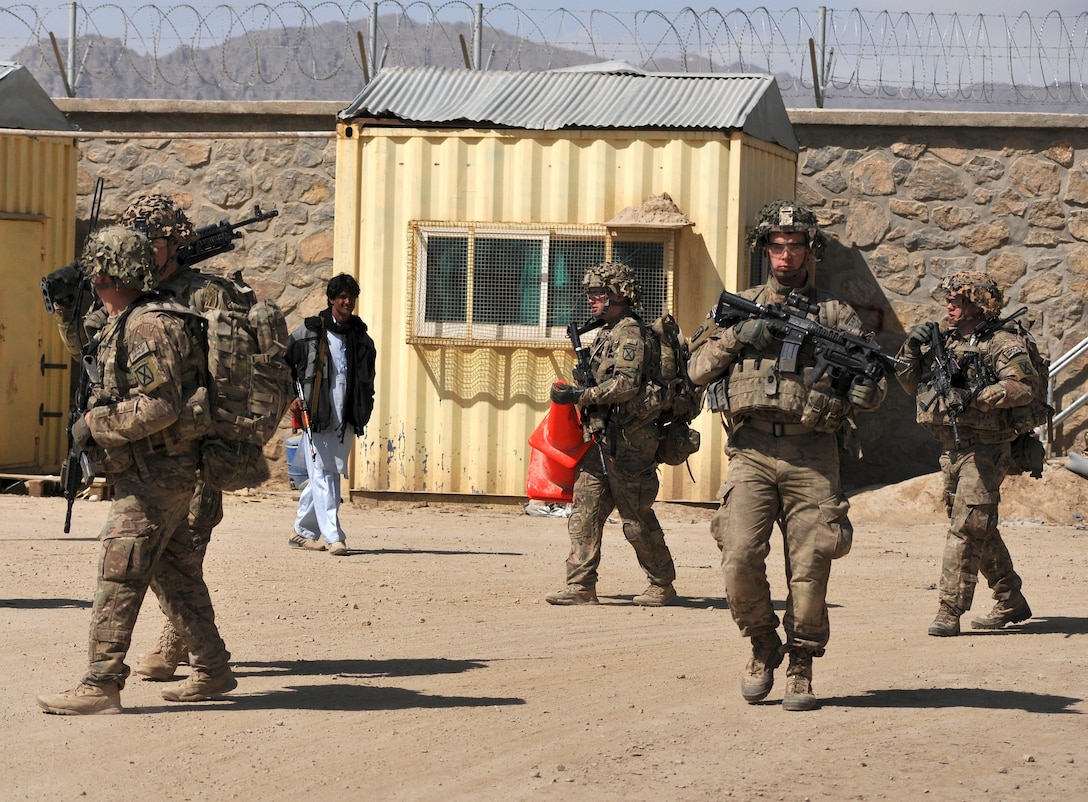 U.S. soldiers close down their position at Forward Operating Base Muqar ...
