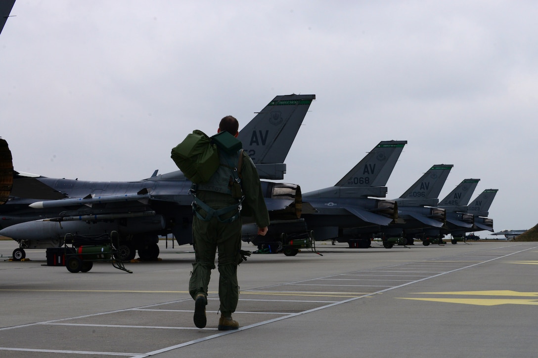 U.S. Air Force 1st Lt. Matthew Alexander walks to his F-16 Fighting ...
