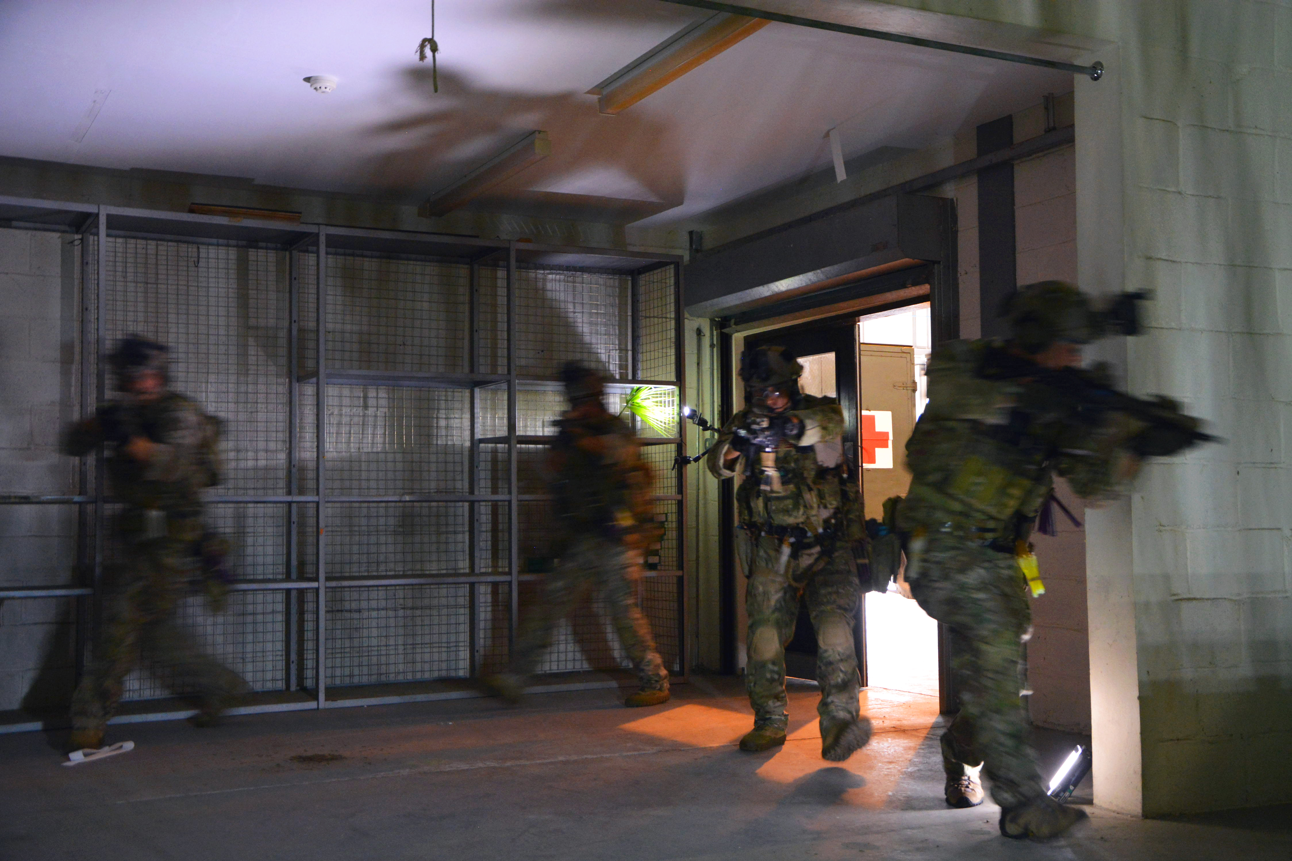 U.S. soldiers conduct a room-clearing exercise as part of Fused ...