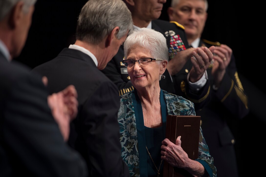Nancy Weinstein accepts the Medal of Honor flag on behalf of her ...