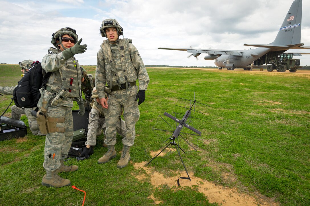 Air Force Airman 1st Class Cameron Alexander, right, and Air Force Lt ...