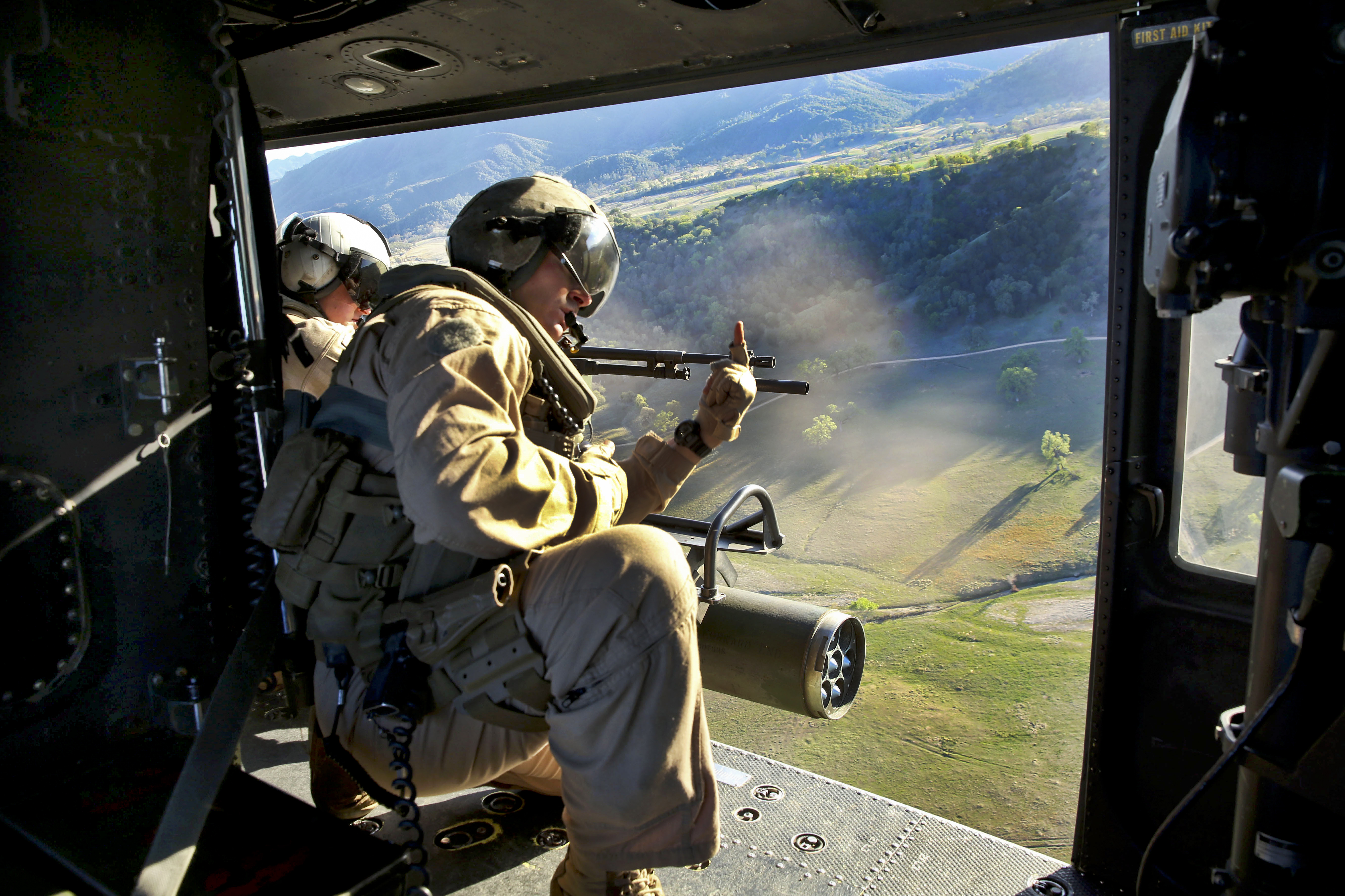 Marine Corps Sgt. Andrew Morey, foreground, directs Marine Corps Lance ...