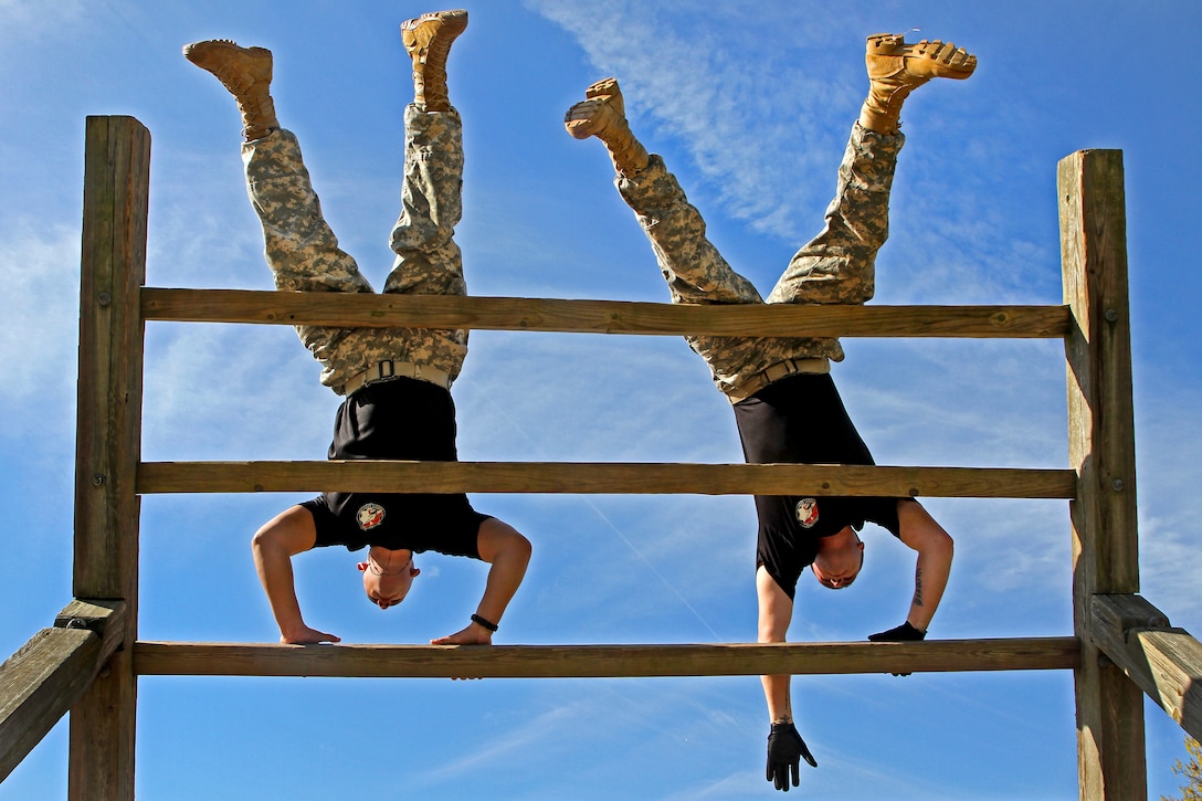 Soldiers descend an obstacle during a confidence course on Fort Benning ...