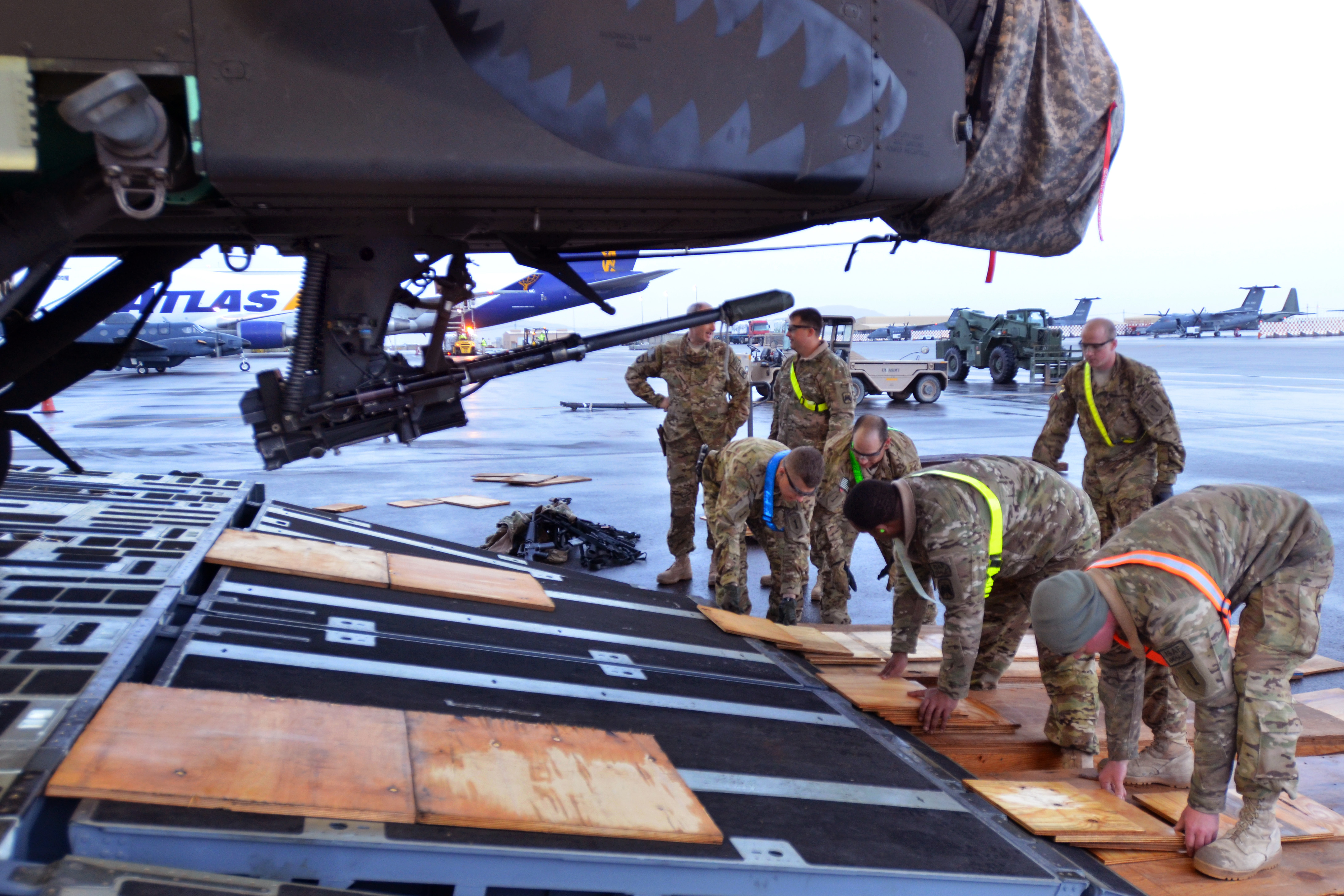 U.S. soldiers build a wooden ramp to decrease the angle of descent of ...