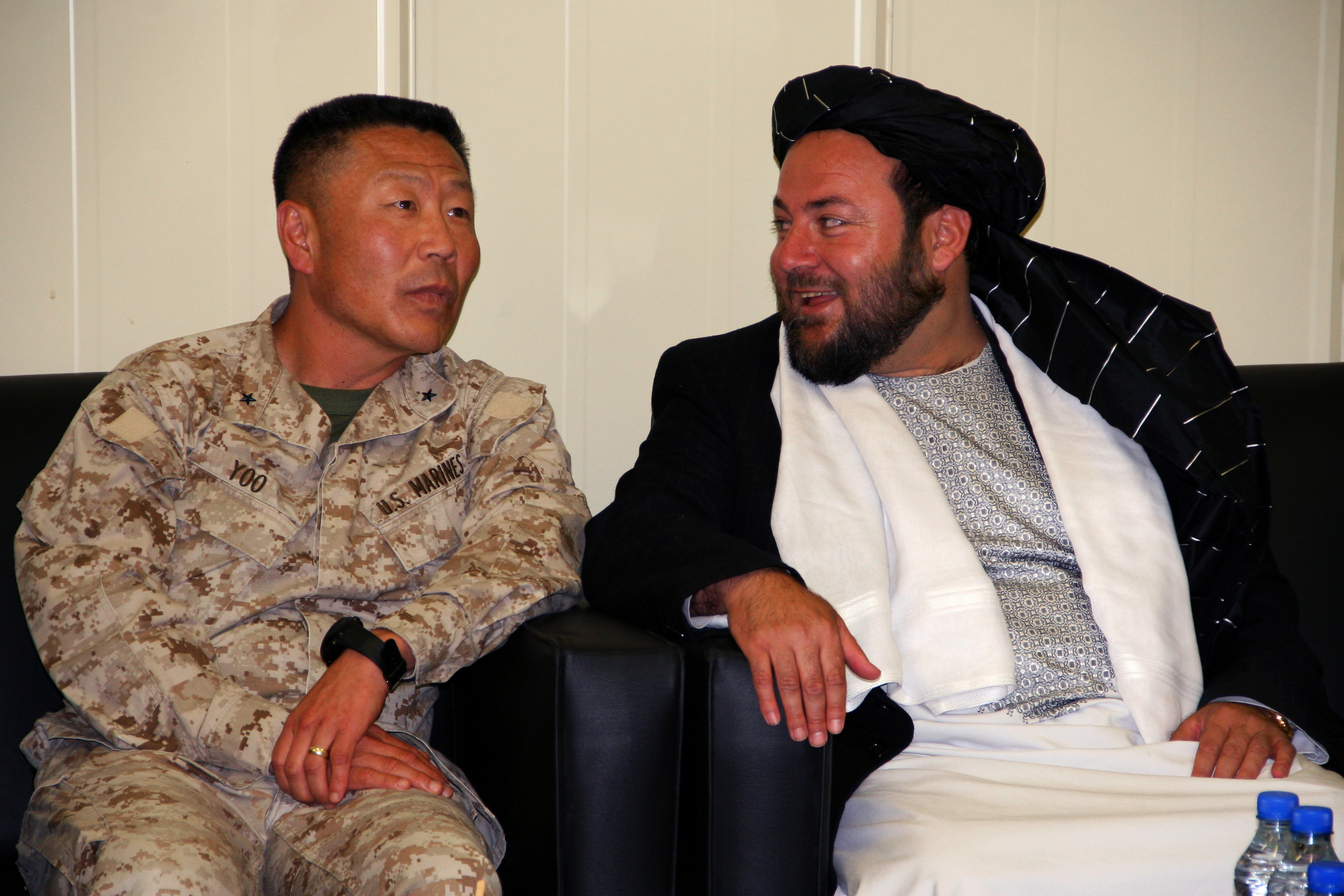 U.S. Marine Corps Brig. Gen. Daniel D. Yoo, left, talks with Amir Mohammad Akhundzada, Nimroz ...