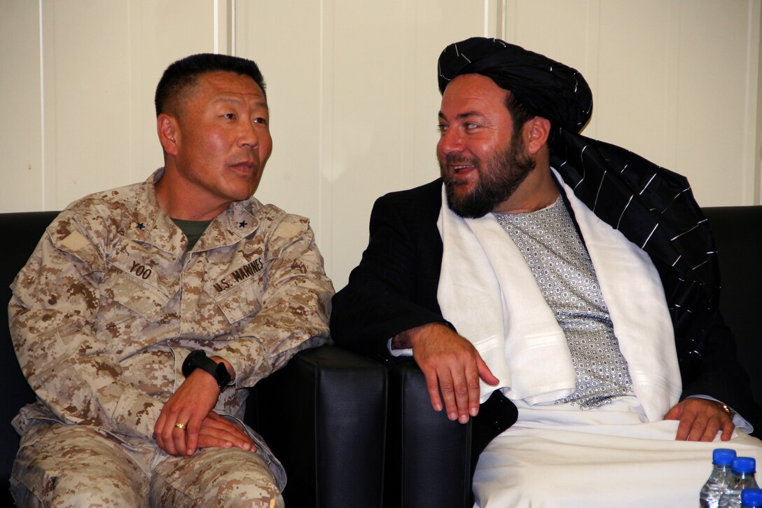 U.S. Marine Corps Brig. Gen. Daniel D. Yoo, left, talks with Amir ...