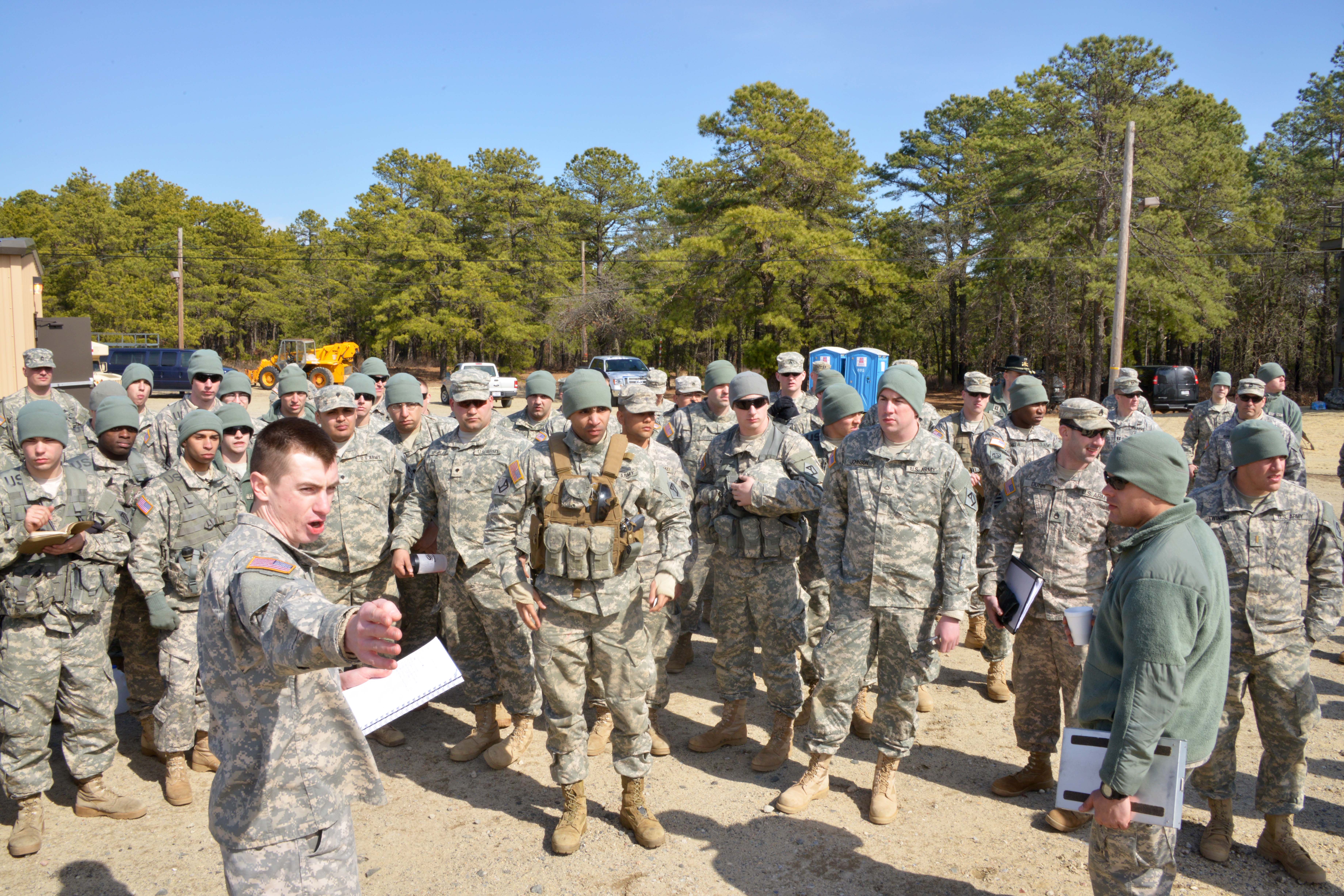 Army 1st Lt. Robert J. Fraser, left foreground, conducts a mission ...
