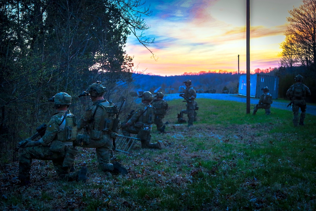 Army Rangers conduct a tactical halt while moving to their training ...