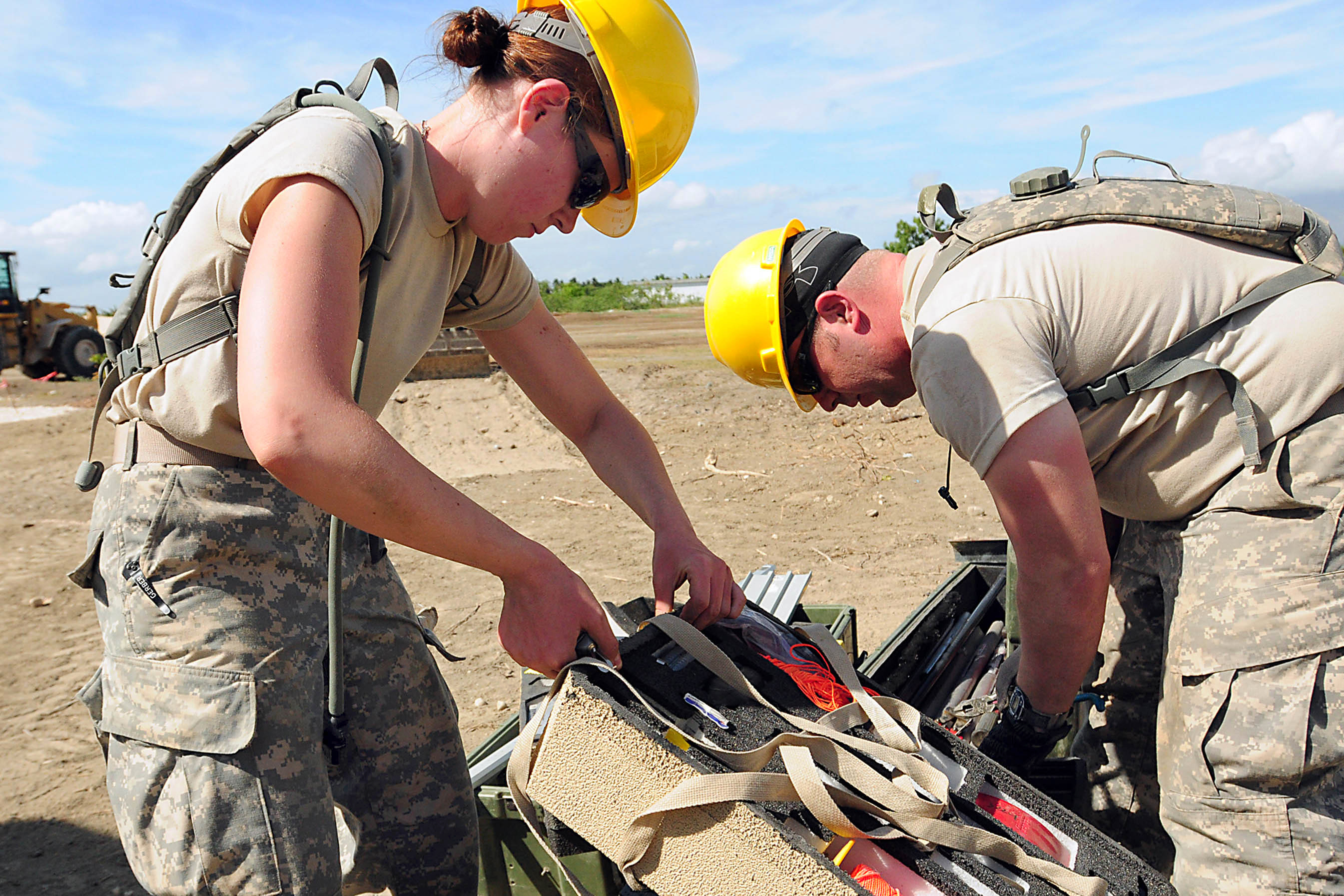 U.S. service members prepare their construction equipment before ...