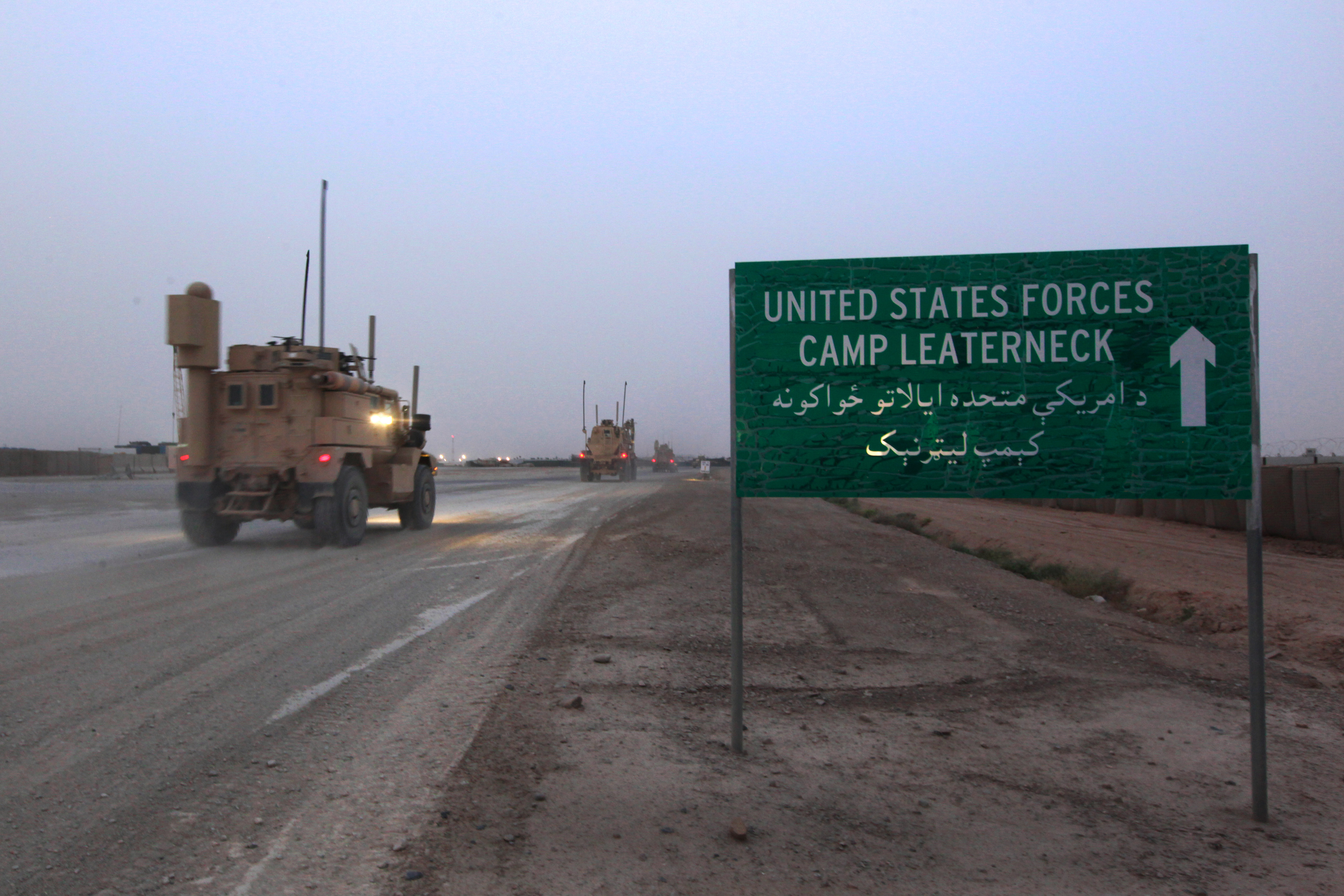 A convoy of vehicles with some of the last U.S. Marines, sailors and ...