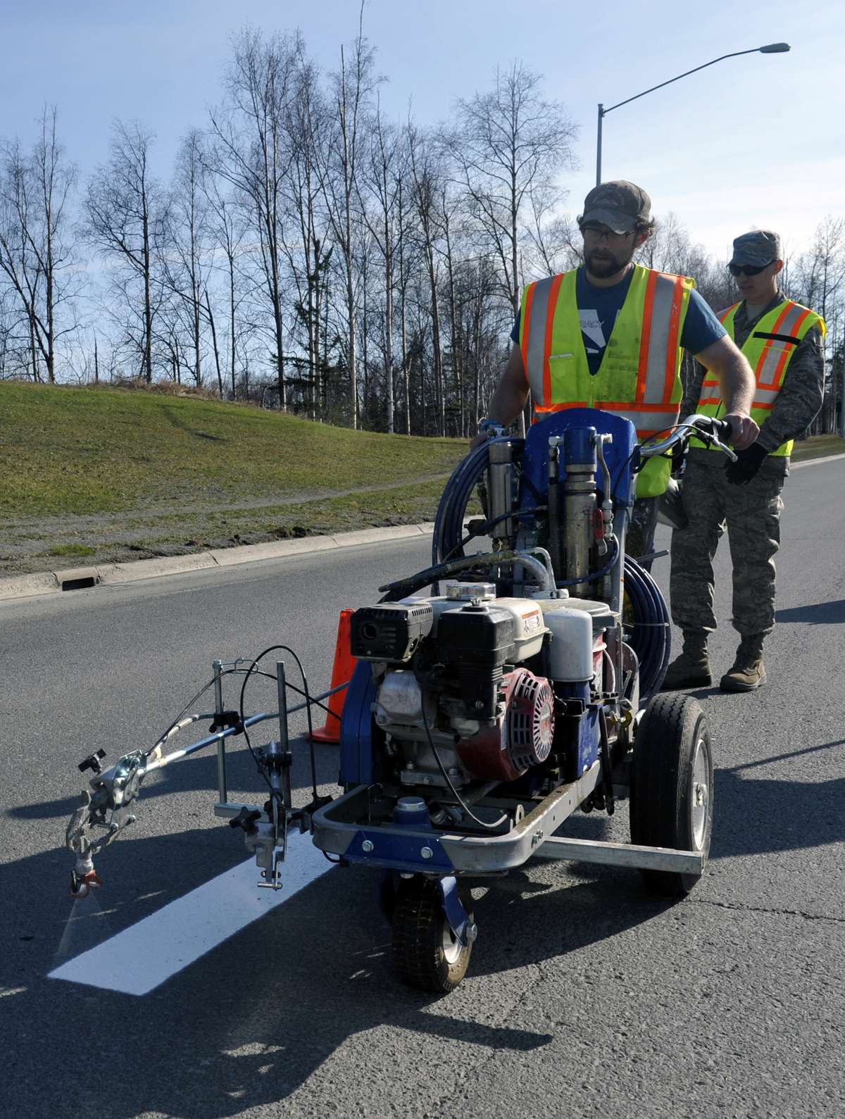 Civil engineers repaint road lines, patch potholes > Pacific Air Forces ...